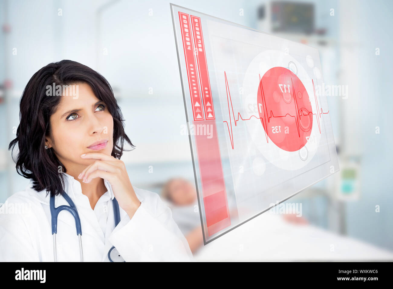 Doctor studying virtual screen showing ECG line in hospital ward Stock ...