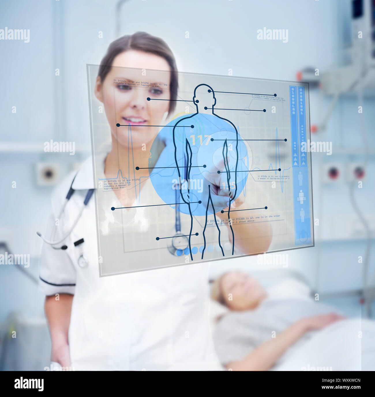 Nurse touching screen displaying blue human form in hospital ward Stock ...