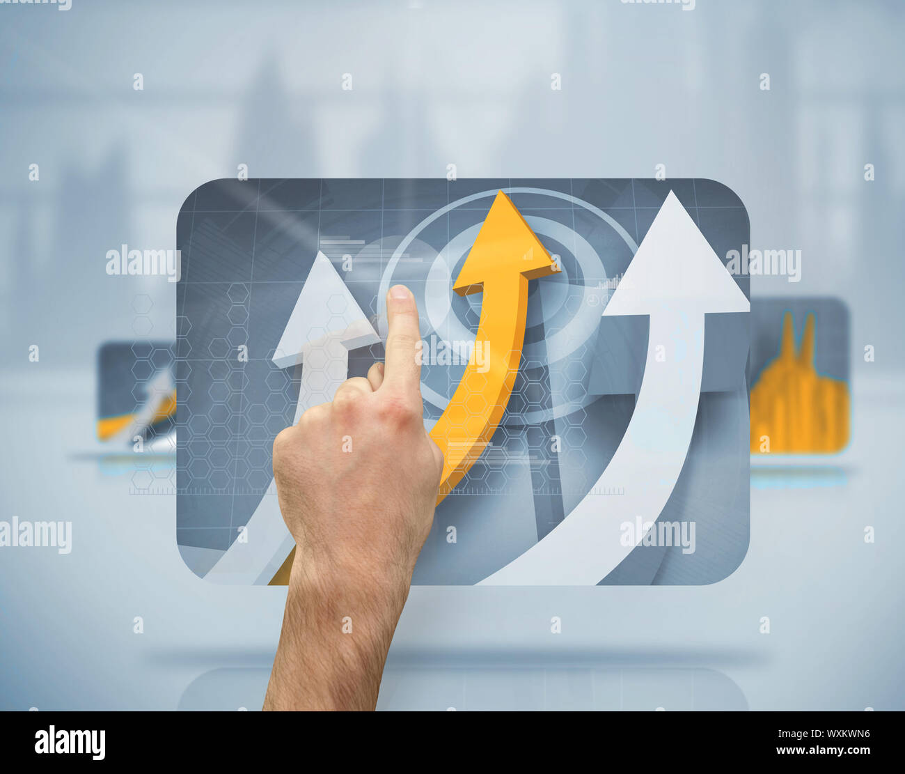 Hand using digital screen with graph arrows Stock Photo - Alamy