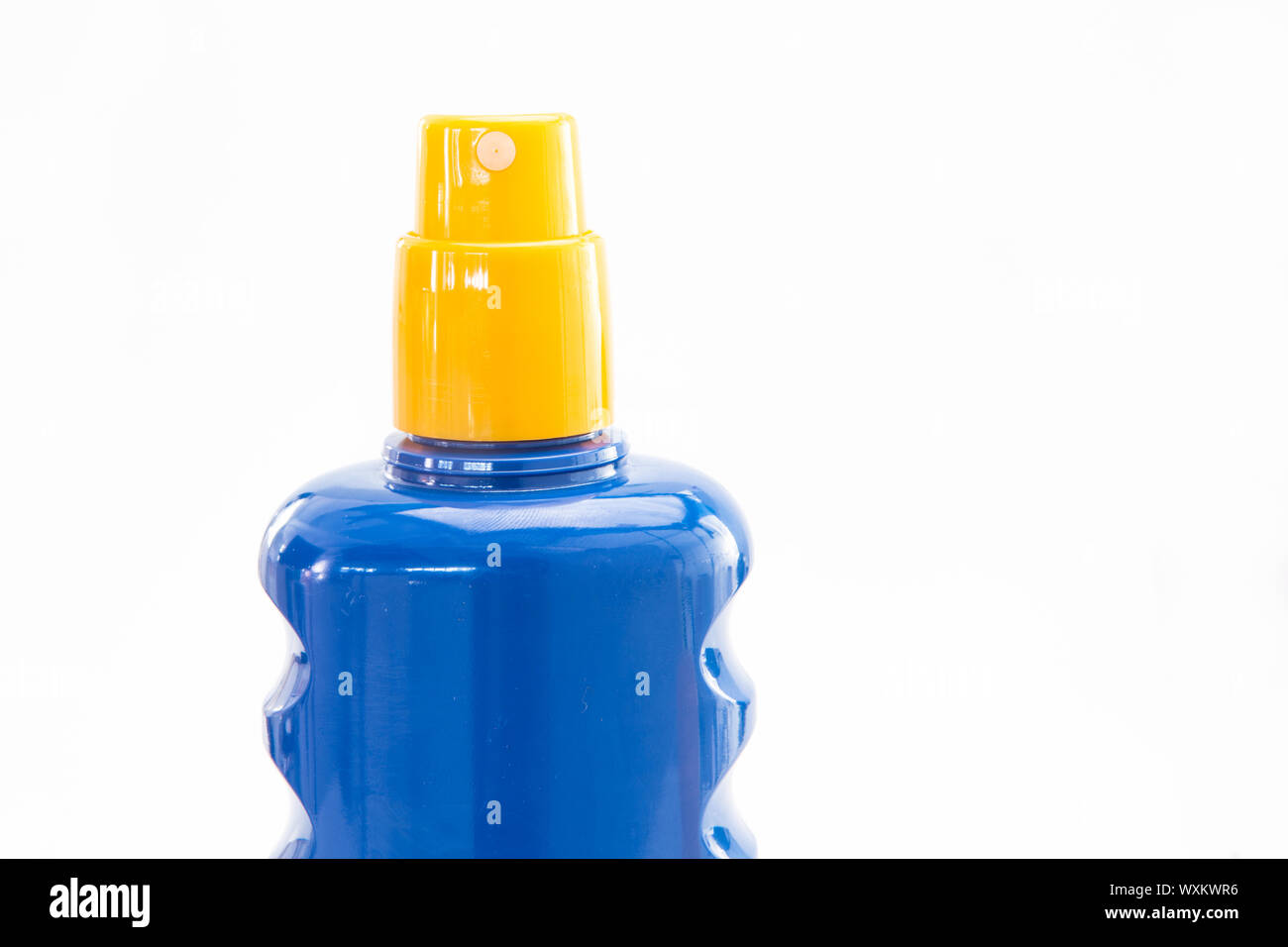 Spray bottle of sun cream on white background Stock Photo - Alamy