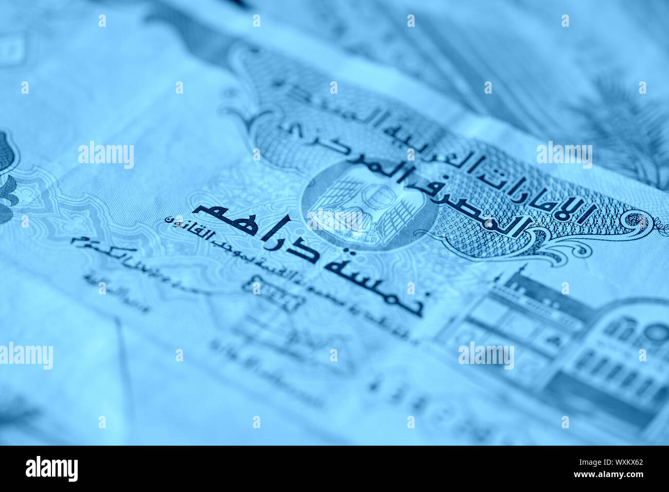 United Arab Emirates banknotes close up blue color toned Stock Photo ...