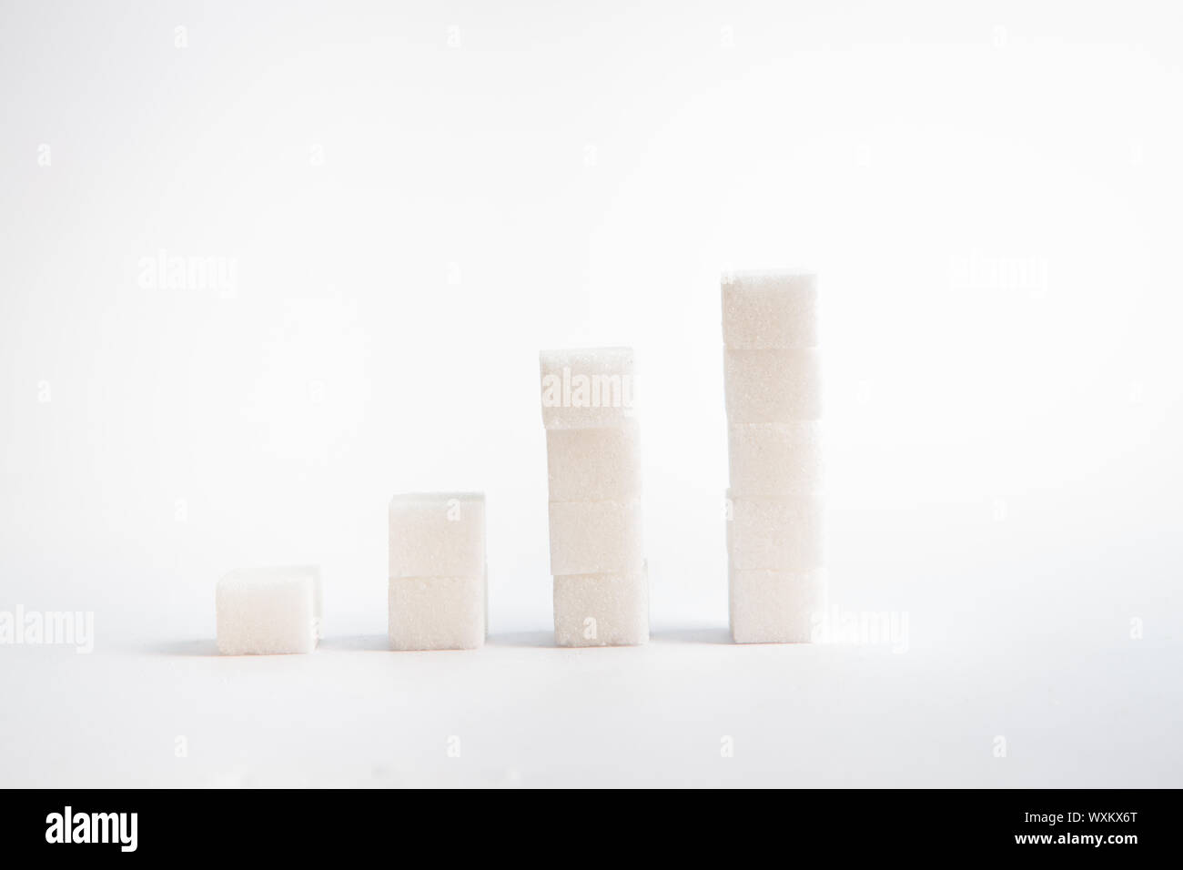 Sugar cubes piled up together Stock Photo - Alamy