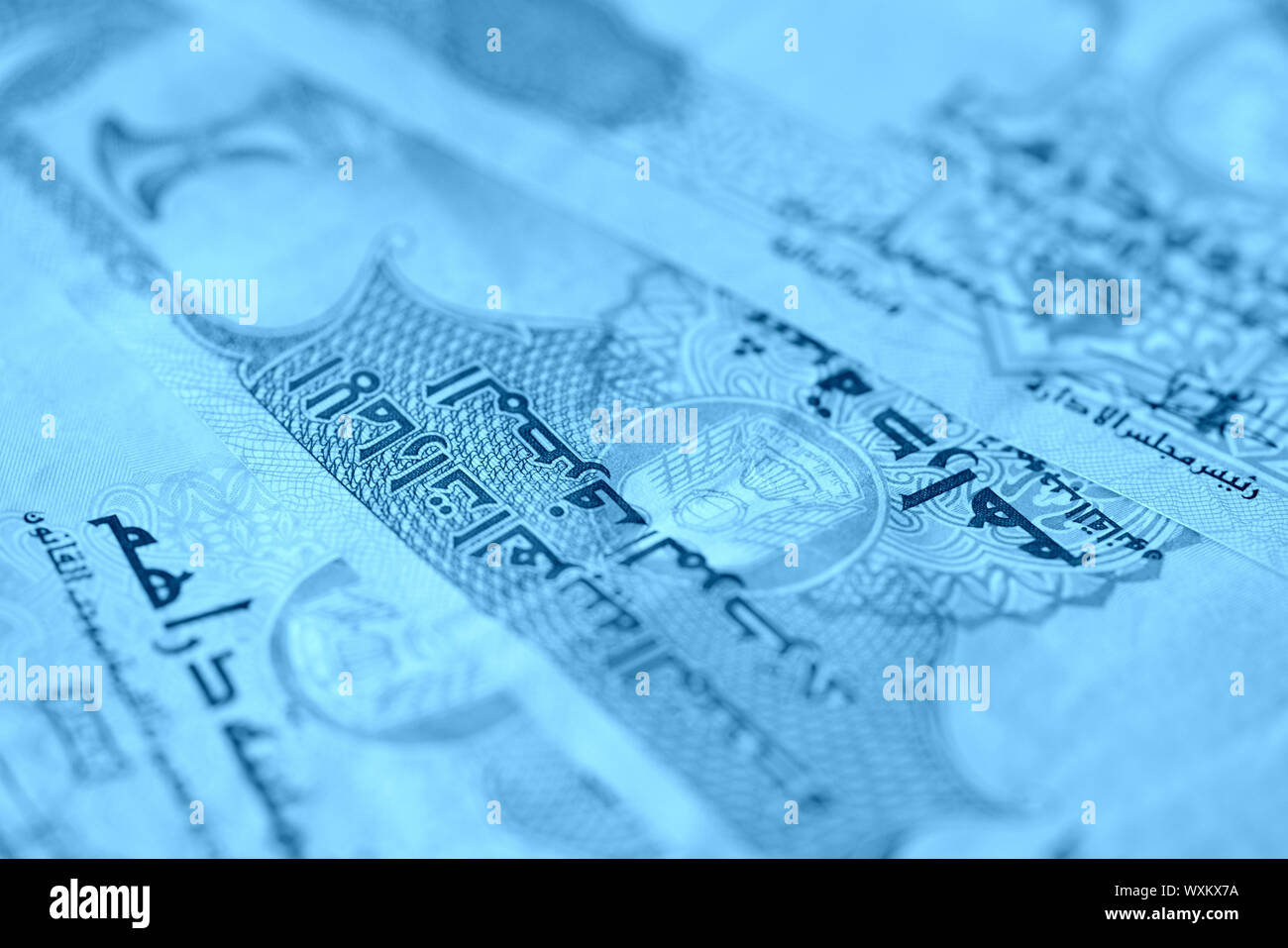 United Arab Emirates banknotes close up blue color toned Stock Photo ...