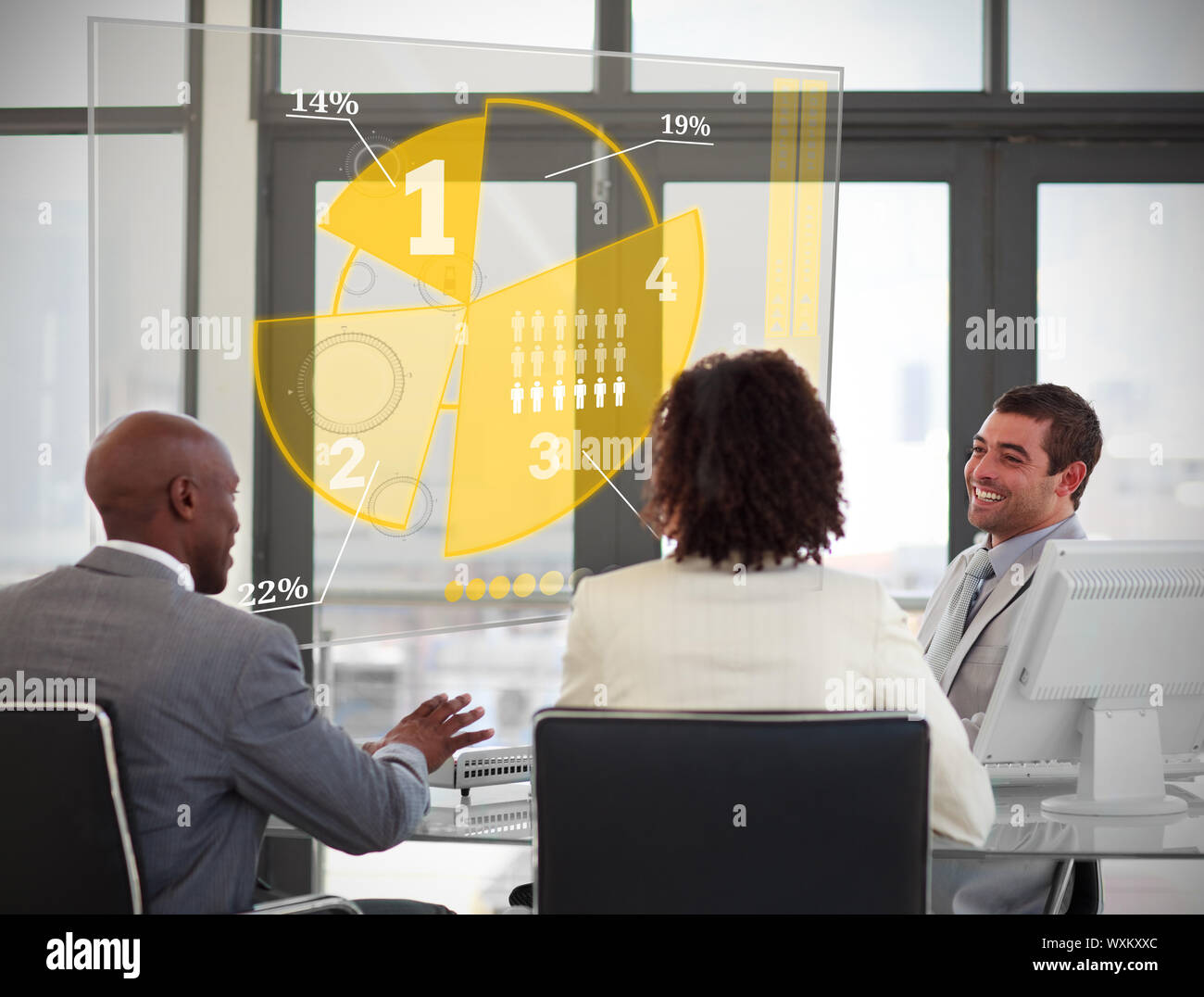 Business people using yellow pie chart interface in a meeting Stock ...