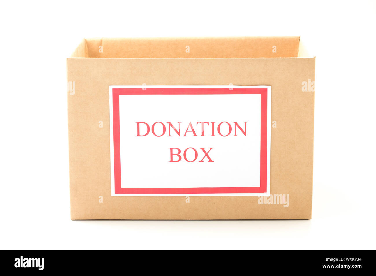 Cardboard donation box on white background Stock Photo - Alamy