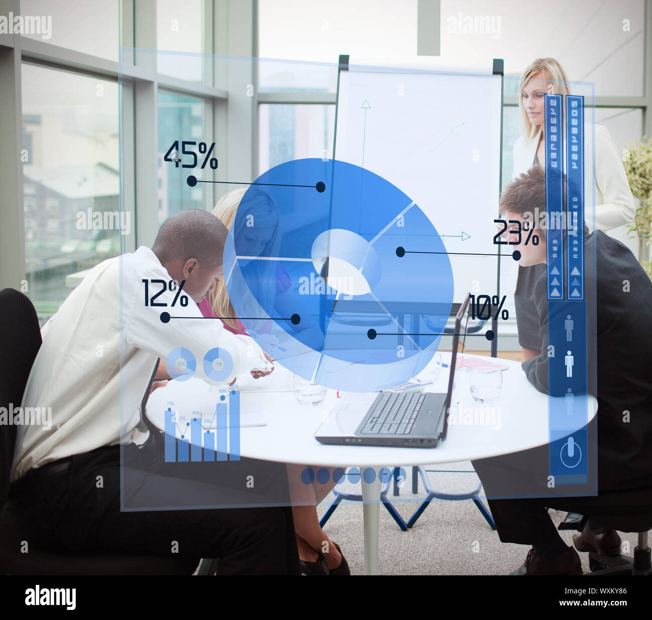 Business people using blue pie chart interface in a meeting Stock Photo ...