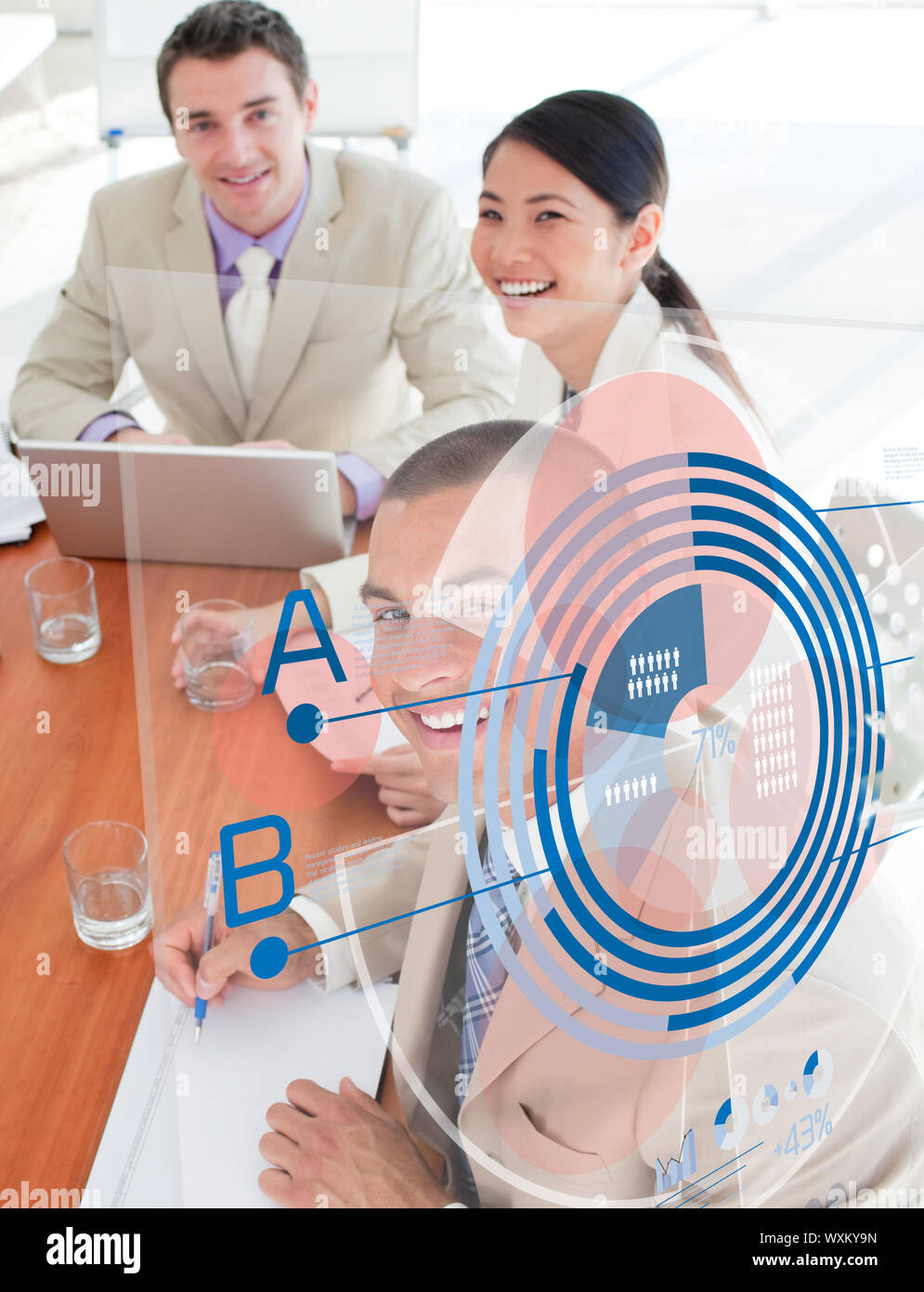 Overview of cheerful colleagues looking at blue chart interface in a ...