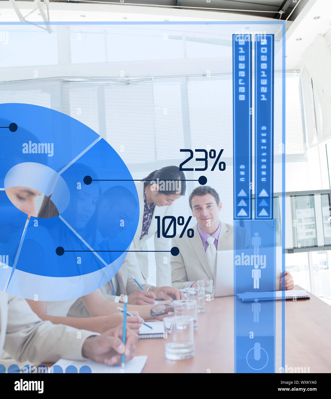 Serious business people using blue pie chart interface in a meeting ...
