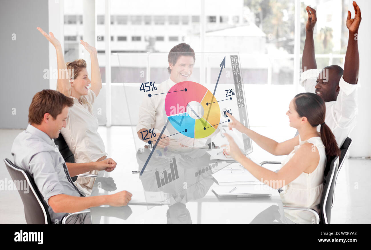 Cheerful business workers using colorful pie chart interface in a ...