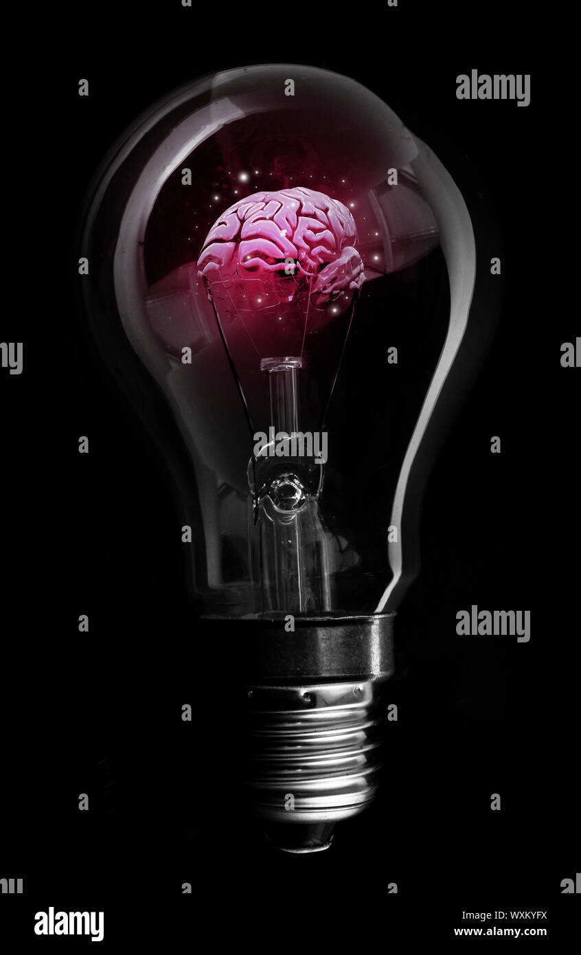 Pink brain inside light bulb on black background Stock Photo - Alamy