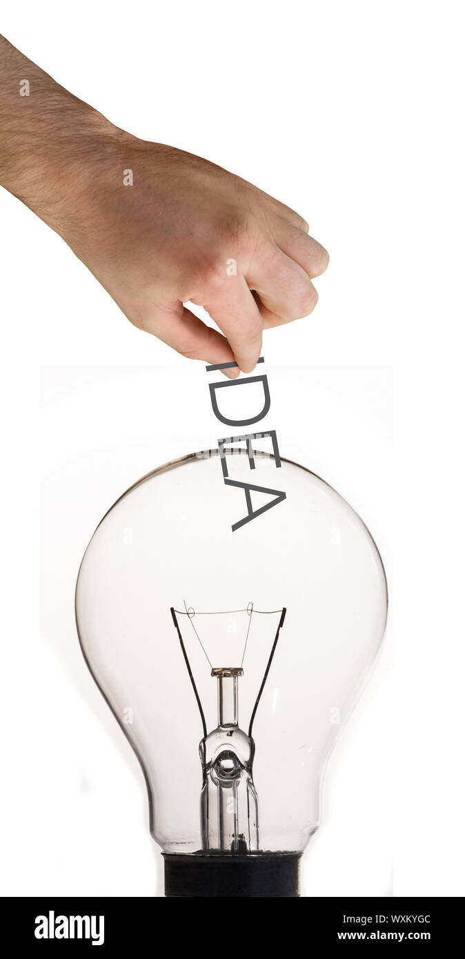Hand grabbing the word idea from a light bulb Stock Photo - Alamy
