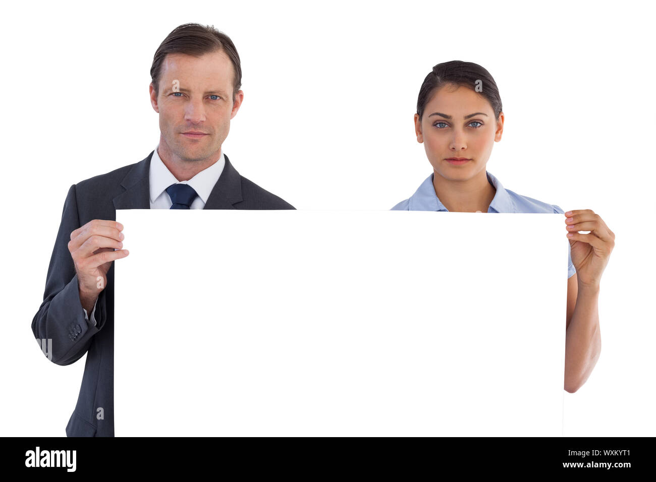 Serious co workers holding a blank copy space on white background Stock ...