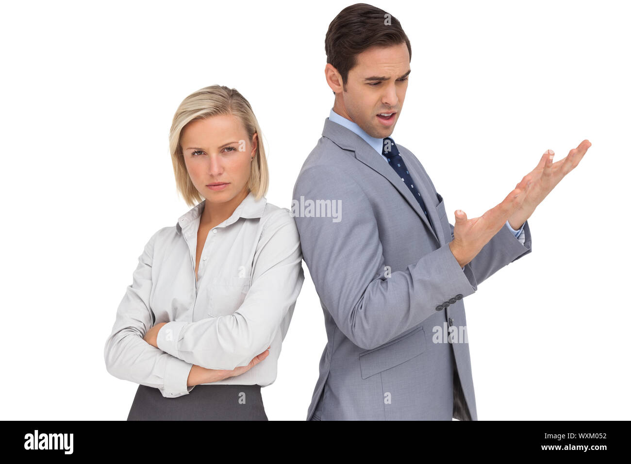 Blonde businesswoman angry against her colleague arguing on white ...