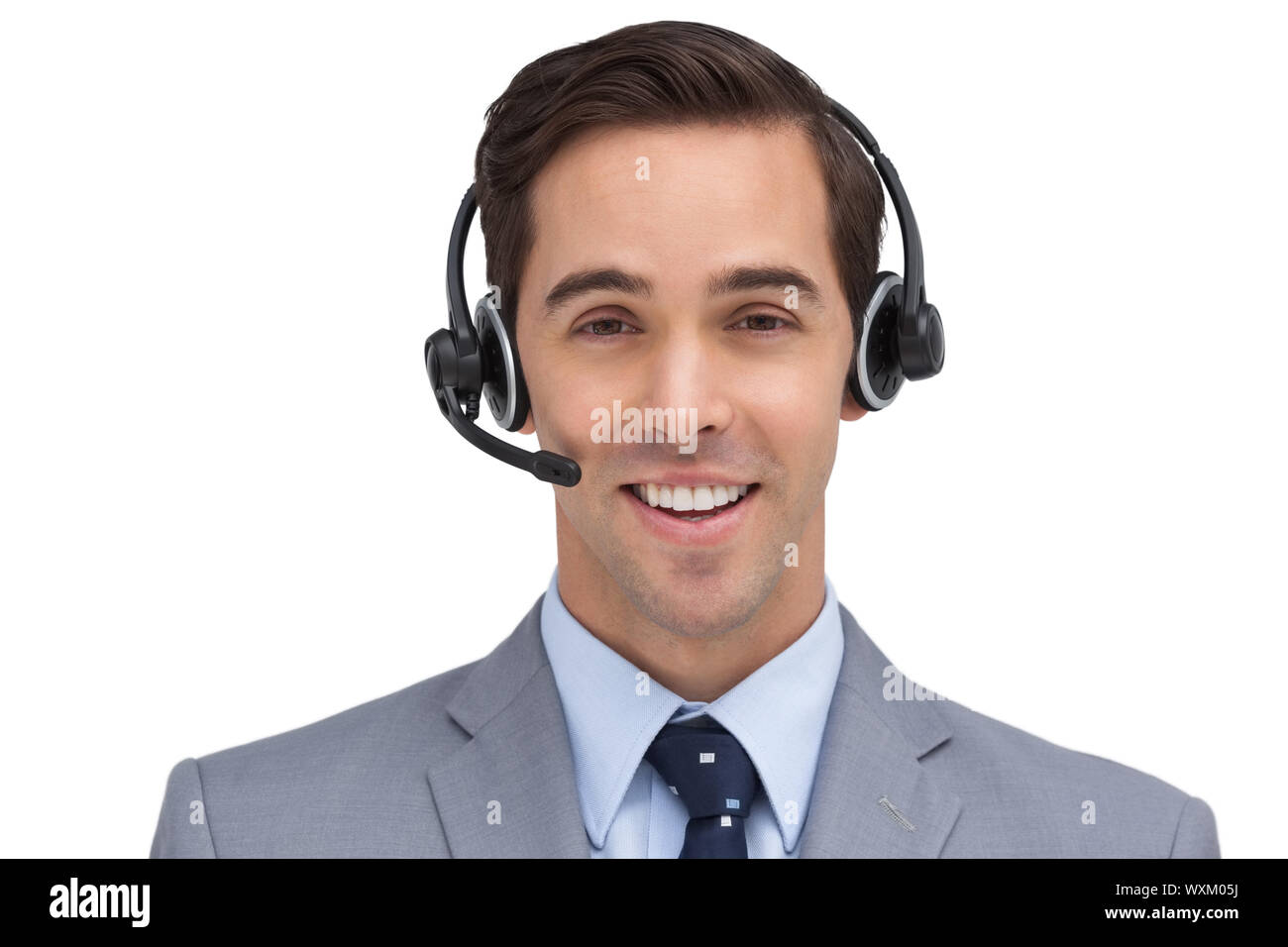 Happy assistant with headset on white background Stock Photo - Alamy