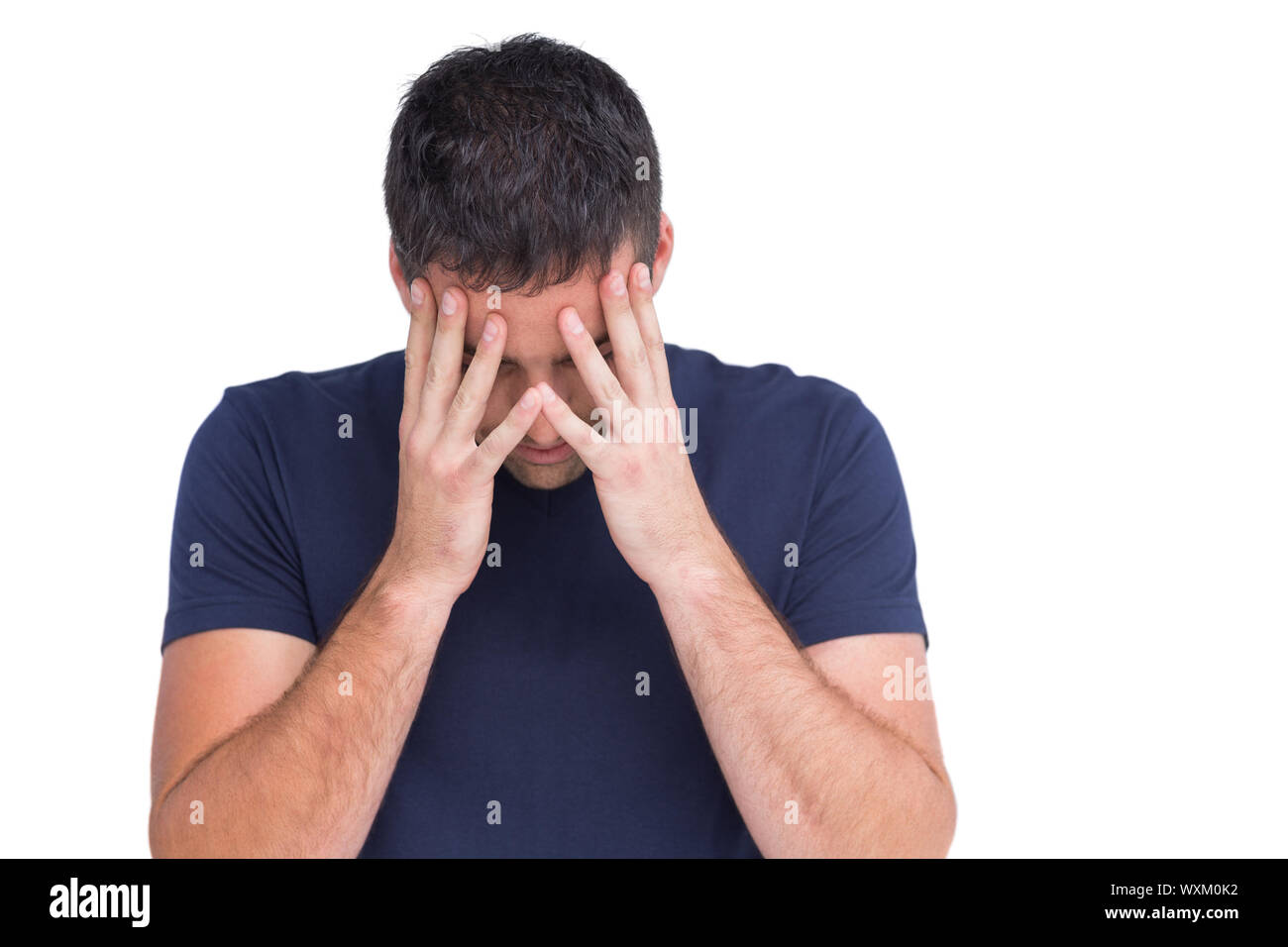 Sad man standing with his head in hands on white background Stock Photo ...