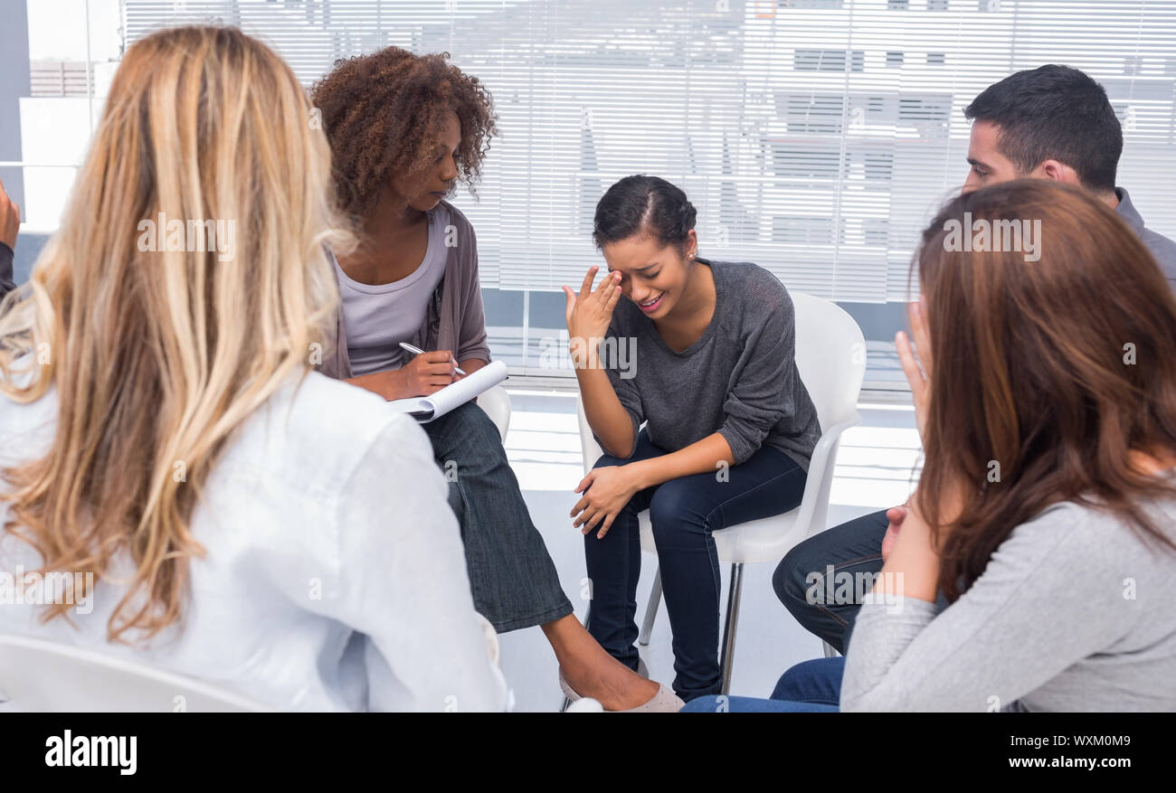 Patient crying during group therapy Stock Photo - Alamy