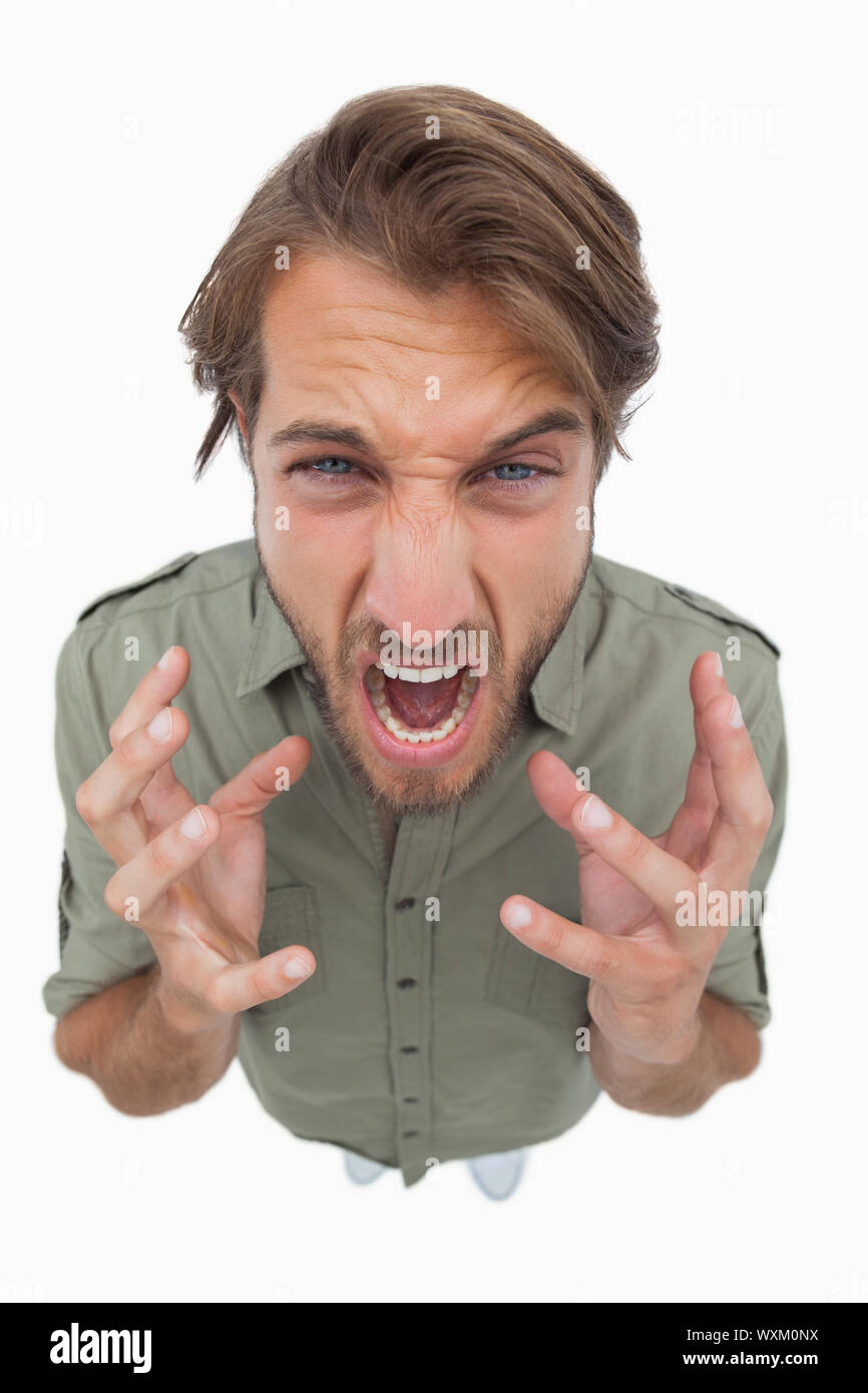 Overhead angle of angry man on white background Stock Photo - Alamy