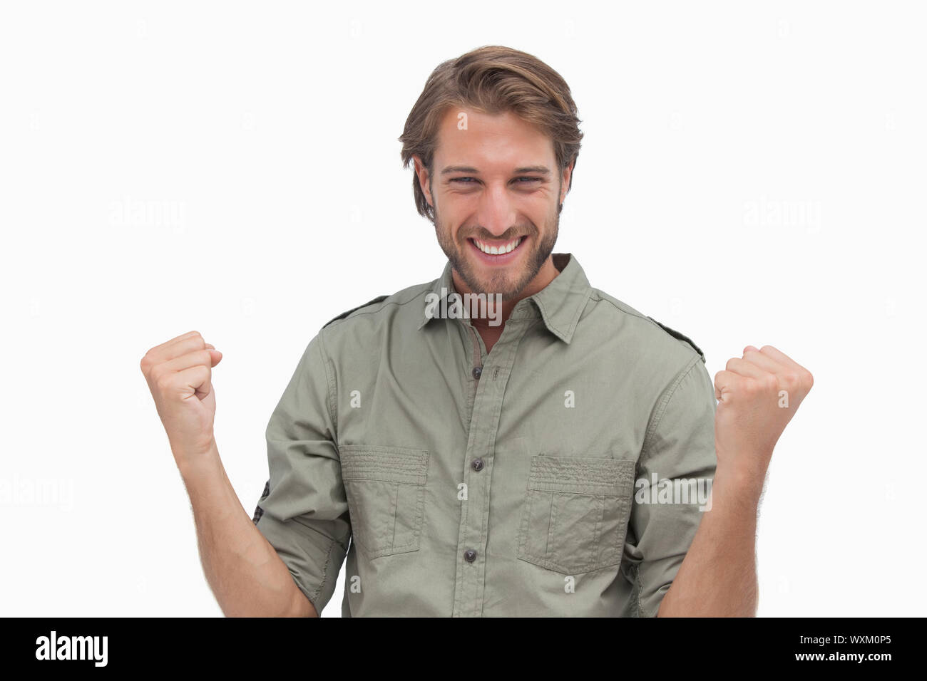 Succesful man cheering on white background Stock Photo - Alamy