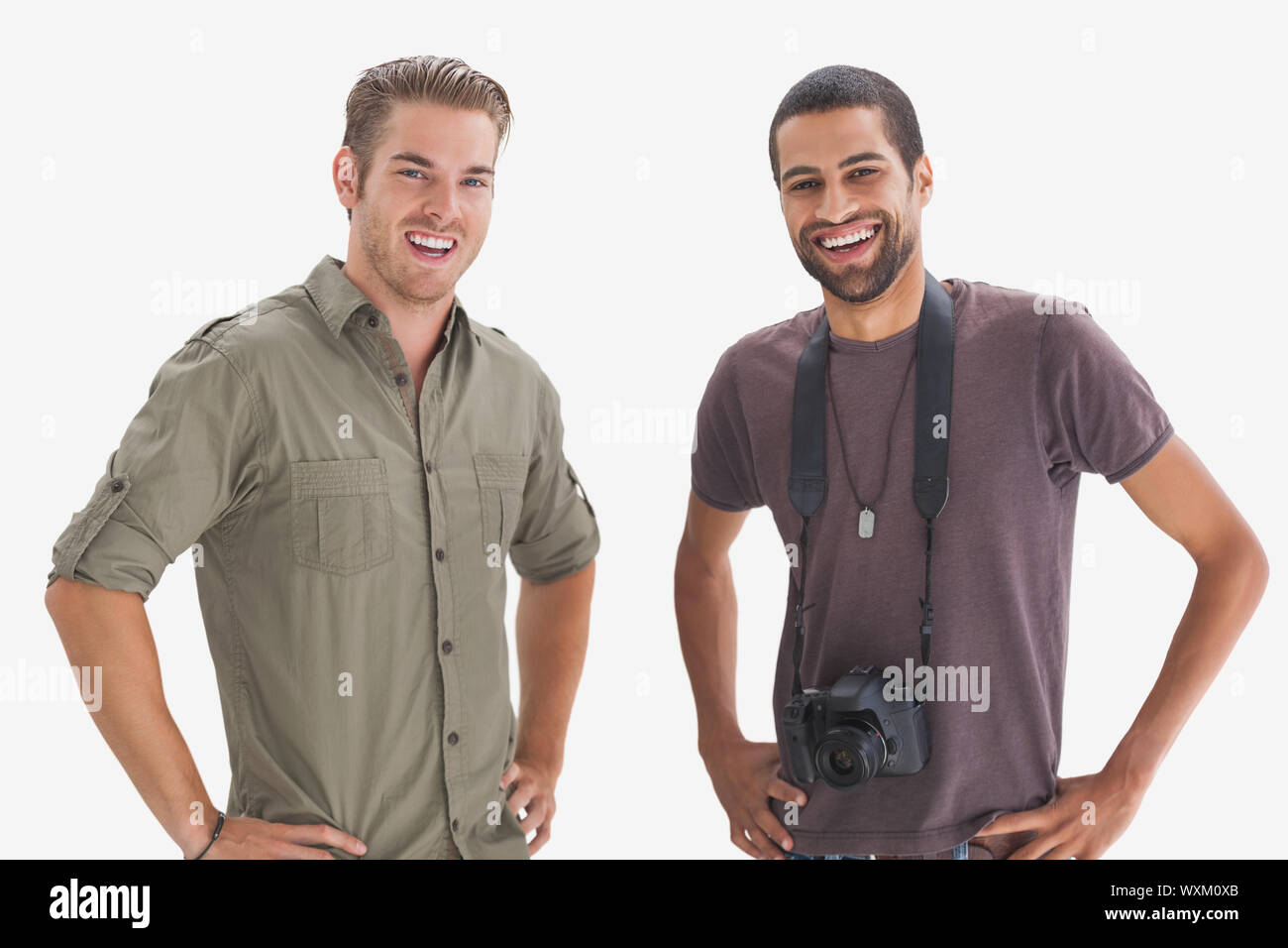 Photographer and his friend smiling at camera on white background Stock ...