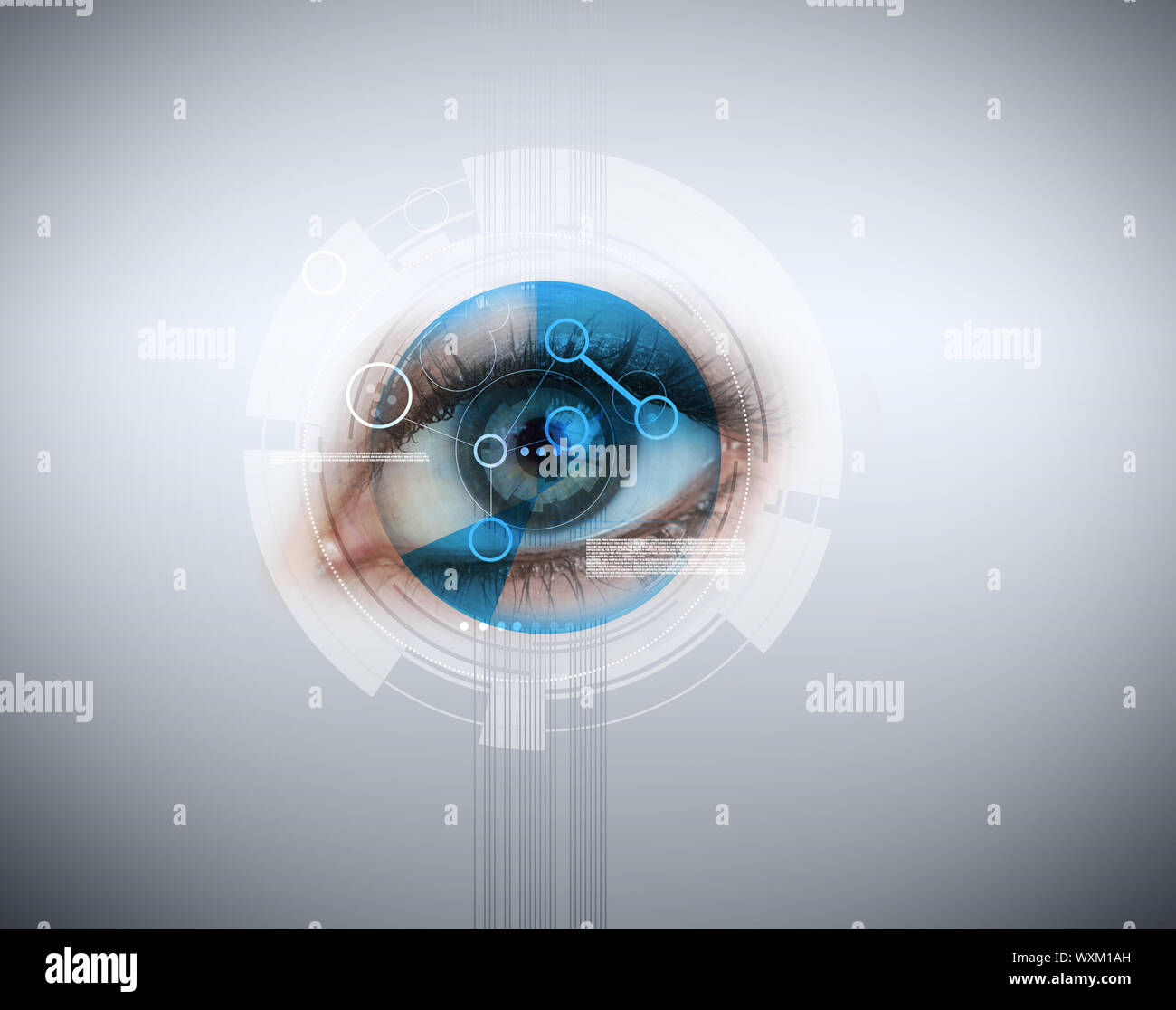 Woman having an eye recognition on grey background Stock Photo - Alamy