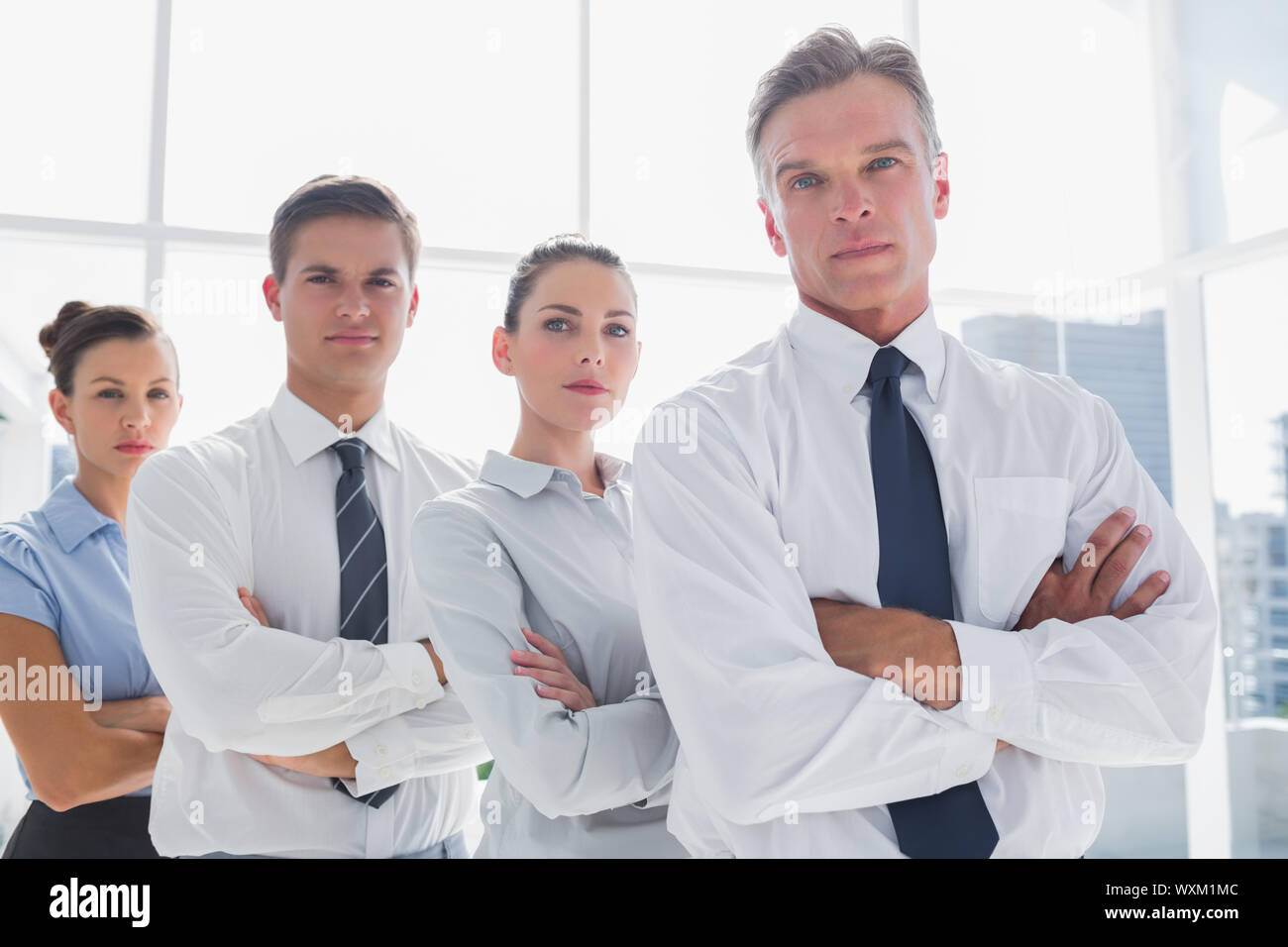 Business people standing together in line in a modern office Stock ...