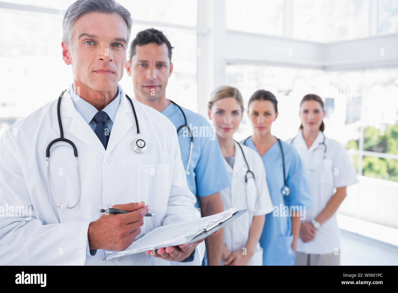Medical team in row hi-res stock photography and images - Alamy