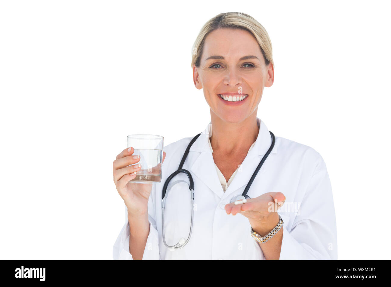 Doctor with medication and a glass of water in her hands on white ...