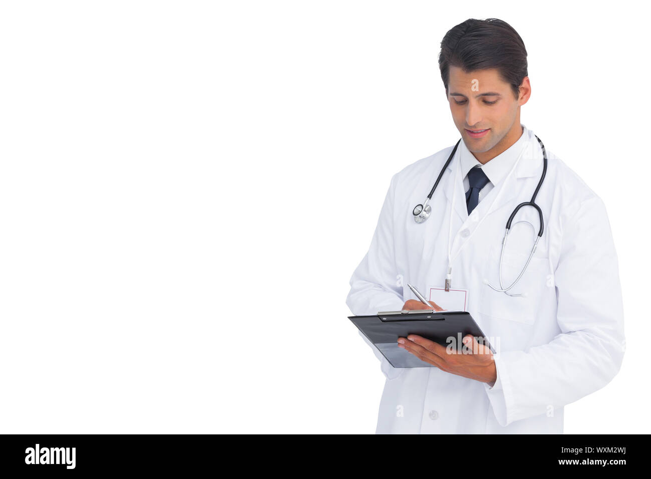 Doctor writing on his clipboard on a white background Stock Photo - Alamy