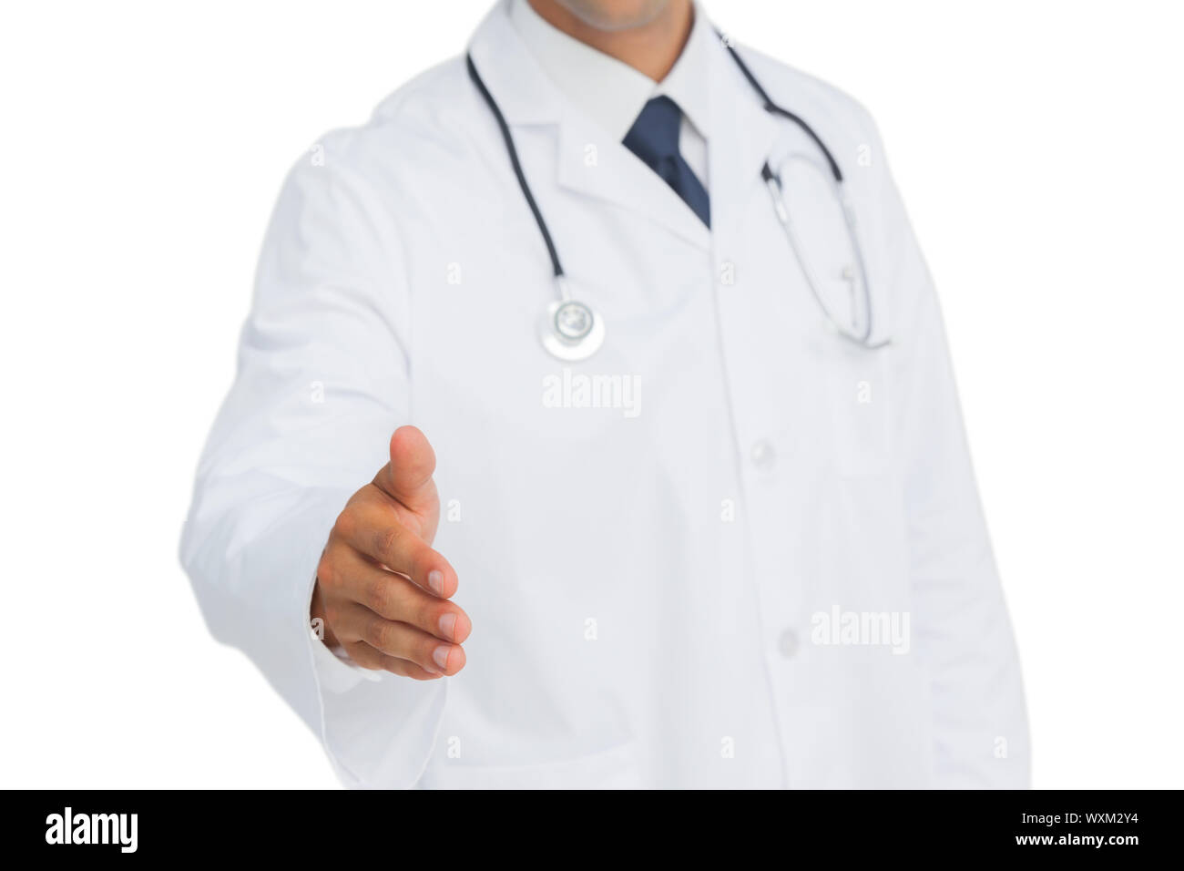 Doctor reaching out for a handshake on white background Stock Photo - Alamy