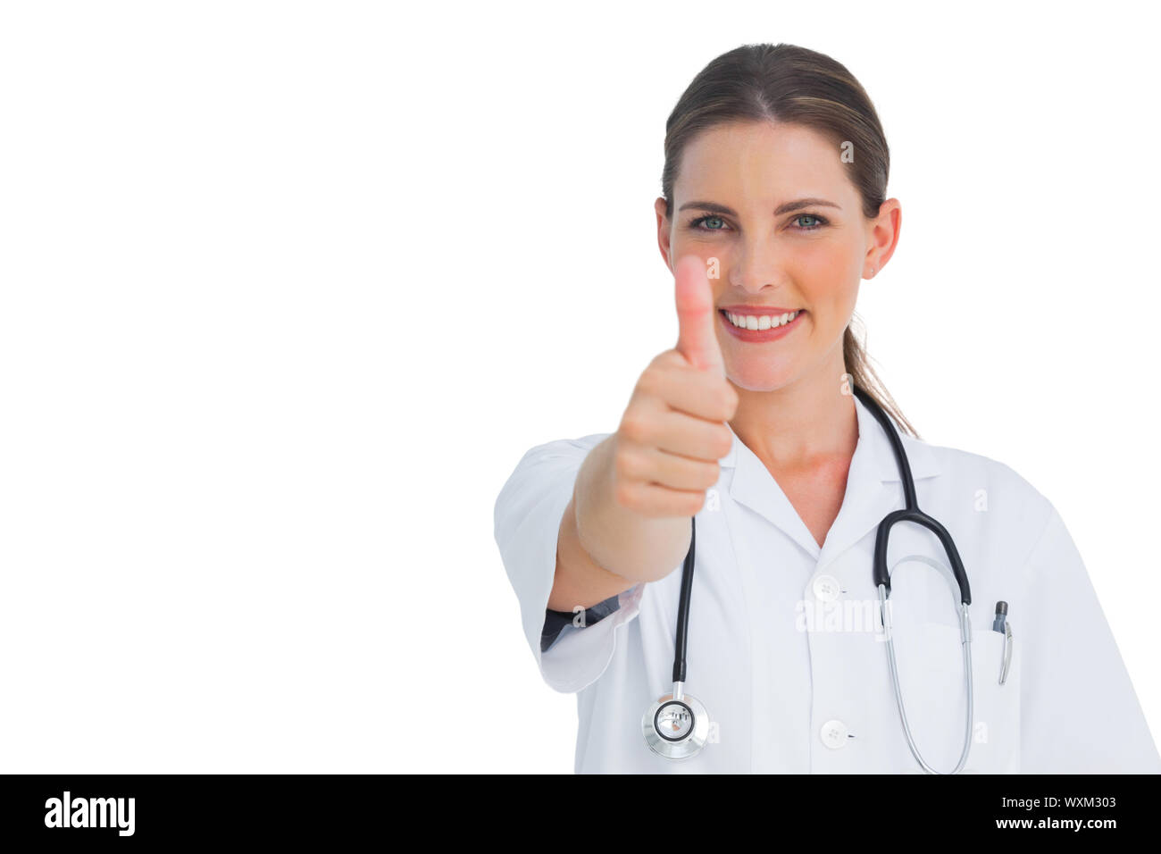 Happy nurse giving thumbs up on white background Stock Photo - Alamy