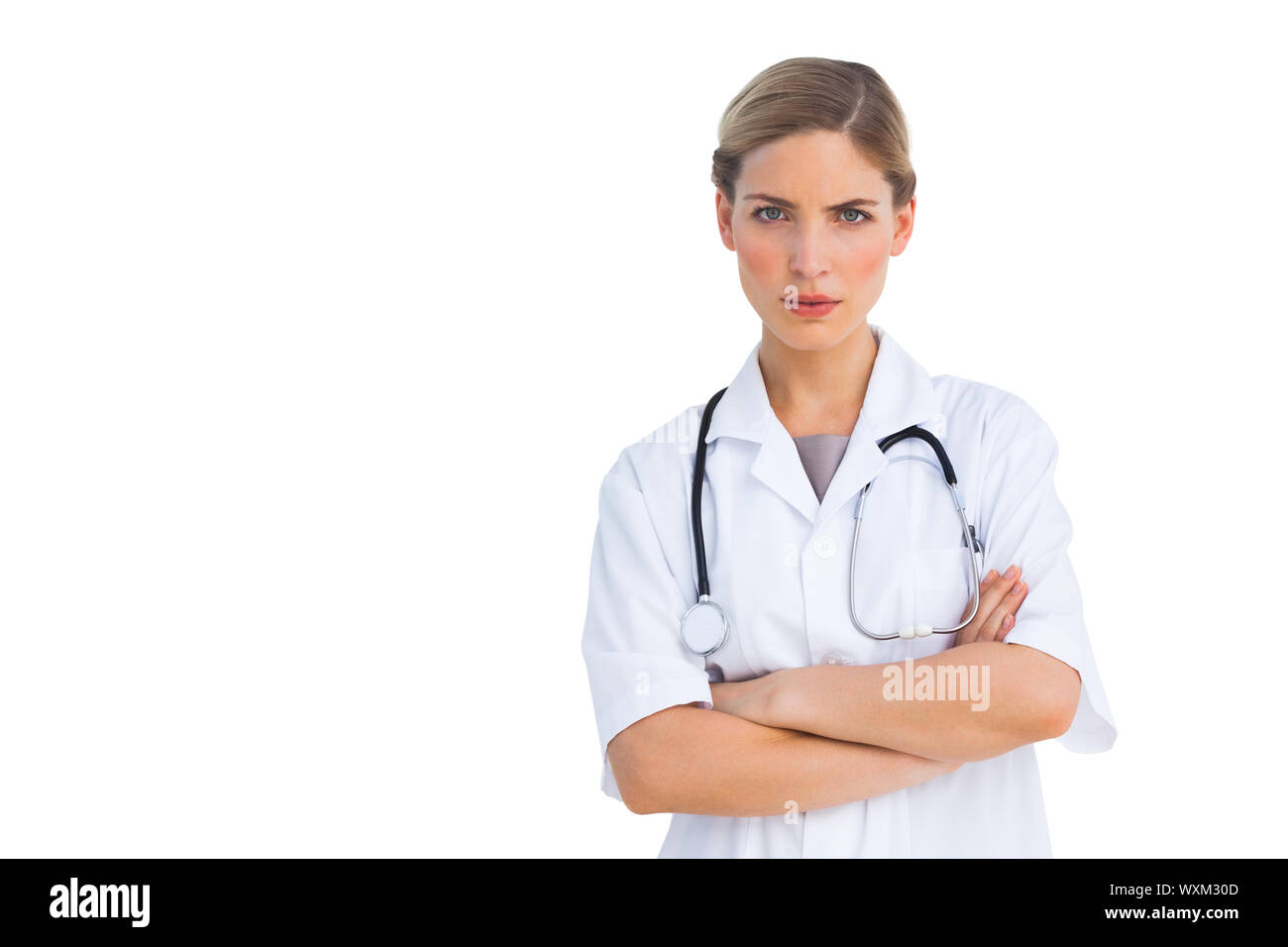 Serious nurse looking at the camera on white background Stock Photo - Alamy
