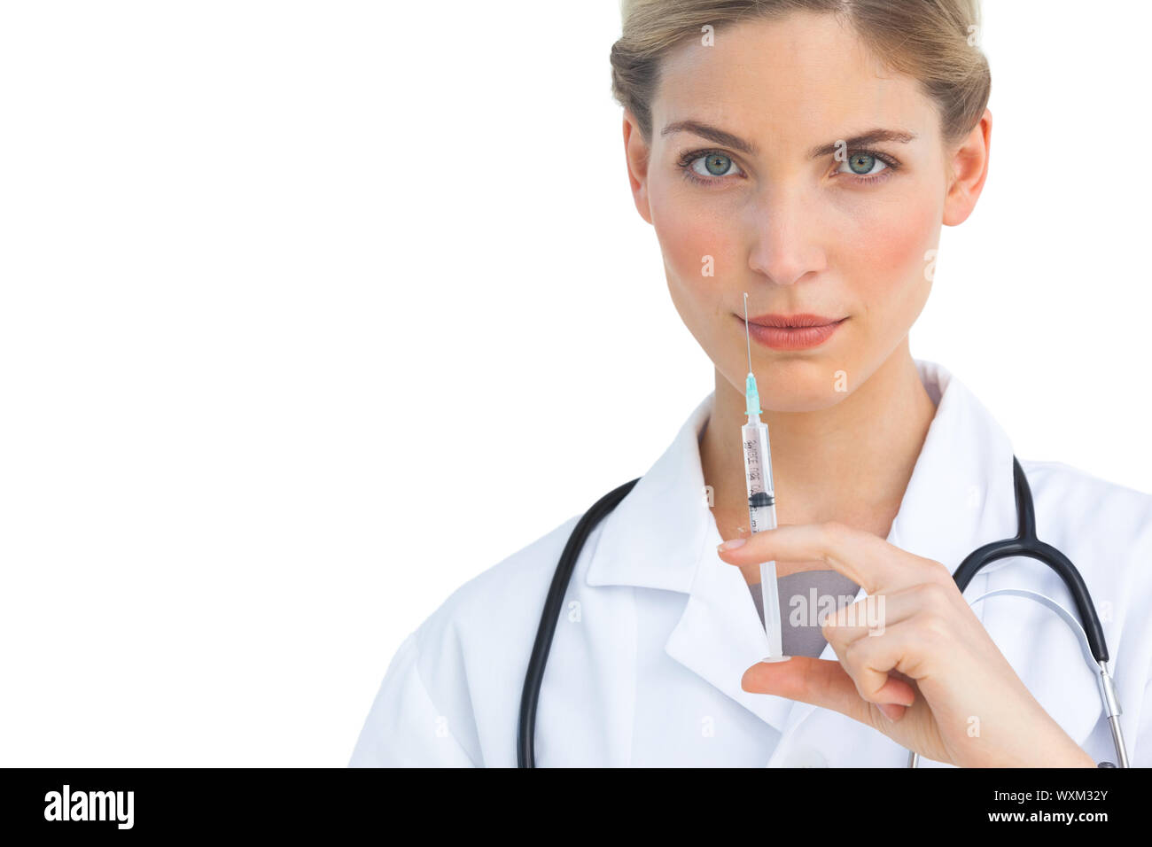 Nurse preparing injection for a patient on white background Stock Photo ...