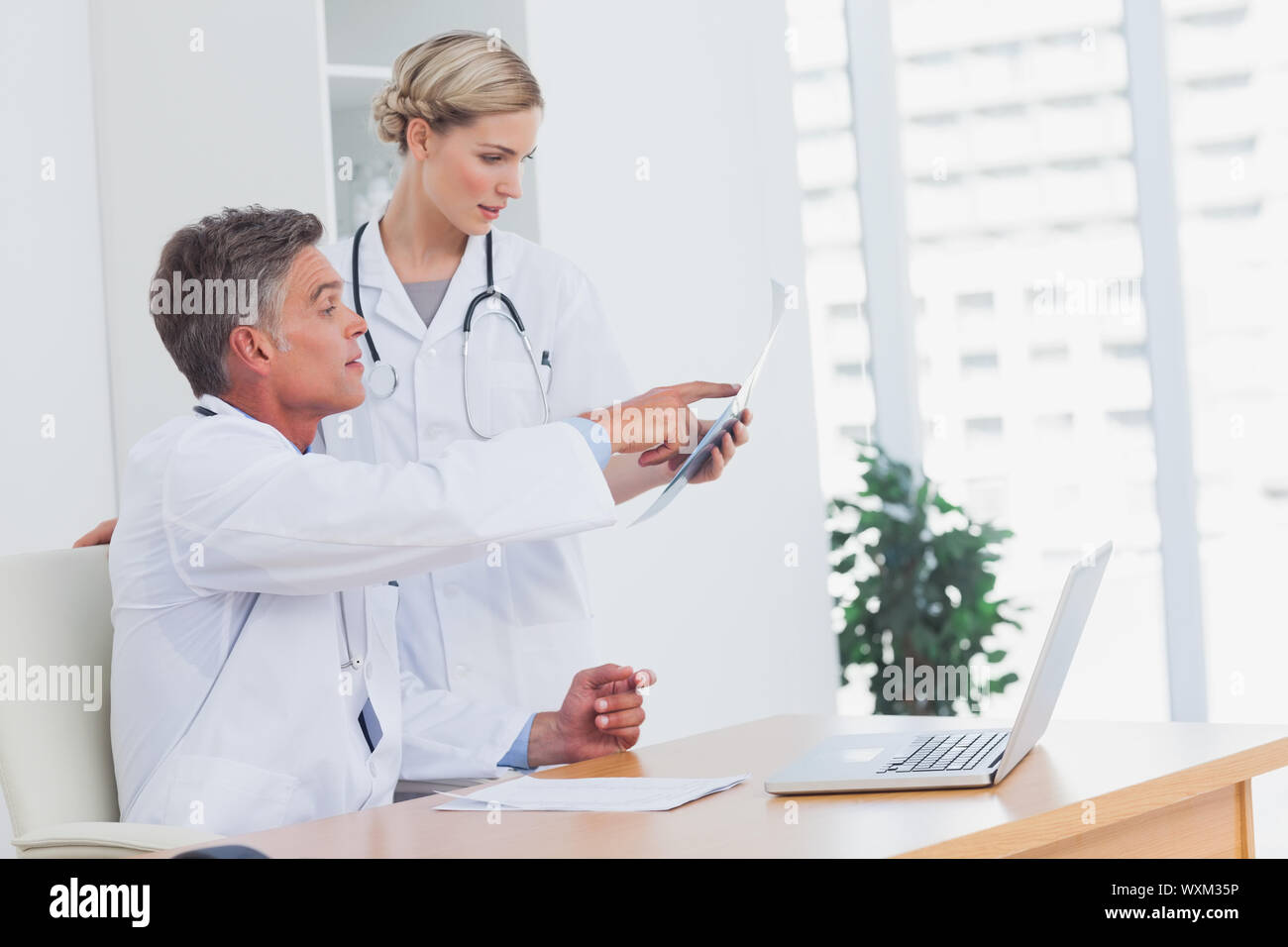 Medical team working at the office Stock Photo - Alamy