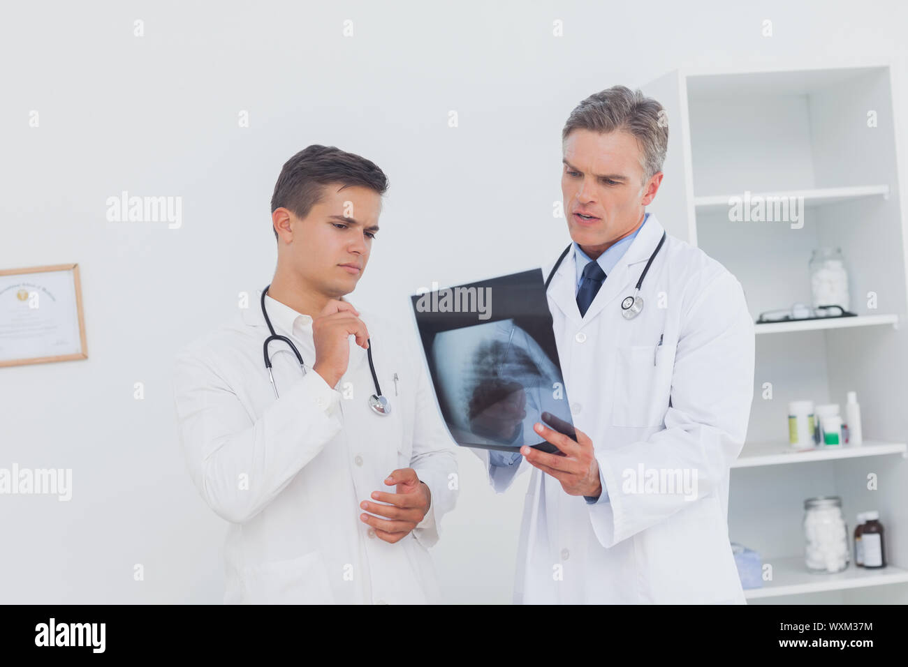 Two doctors speaking in hi-res stock photography and images - Alamy