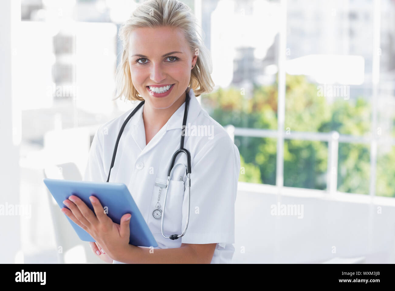 Nurse scrolling on digital tablet hi-res stock photography and images ...