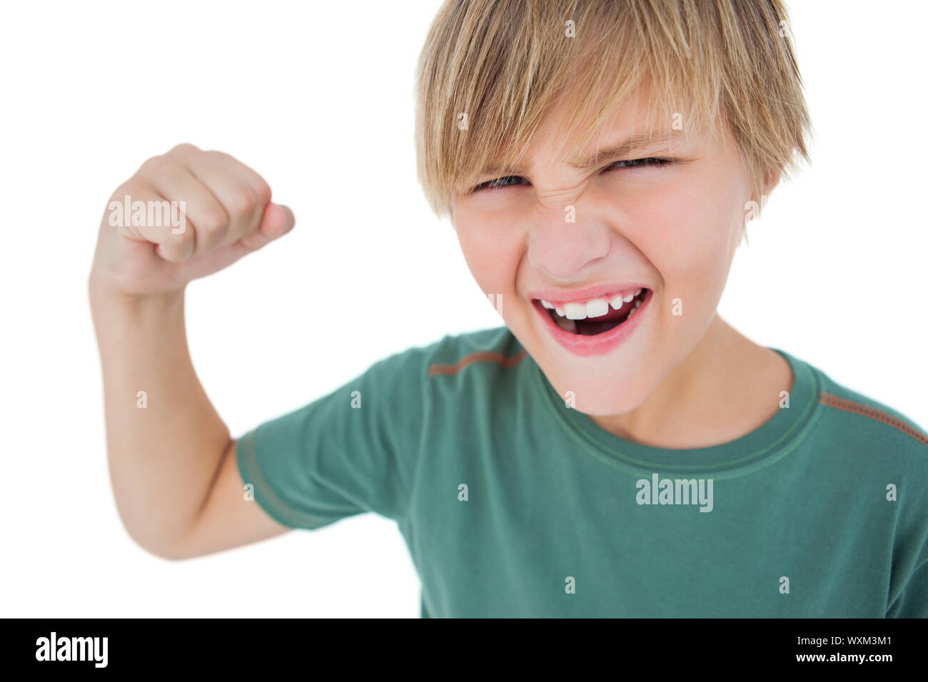 Angry boy tensing arm muscle on white background Stock Photo - Alamy