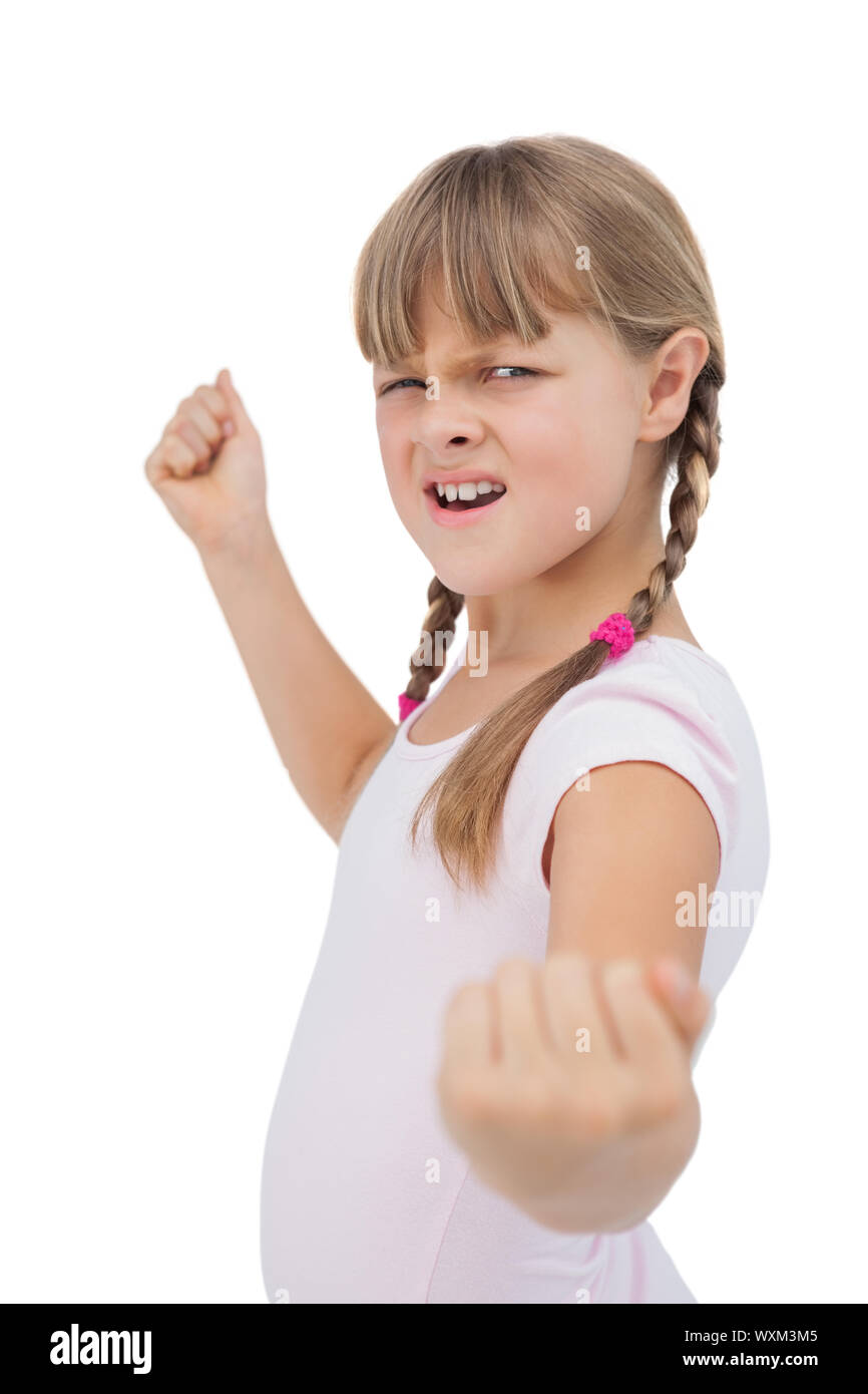 Furious little girl showing her fist on white background Stock Photo ...