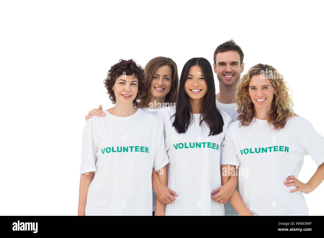Smiling group of volunteers standing on white background Stock Photo ...