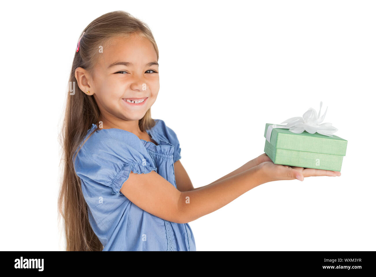Cheerful little girl giving a present on white background Stock Photo ...
