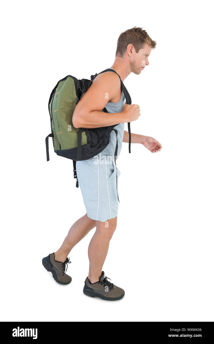 Man walking with sport bag on white background Stock Photo - Alamy