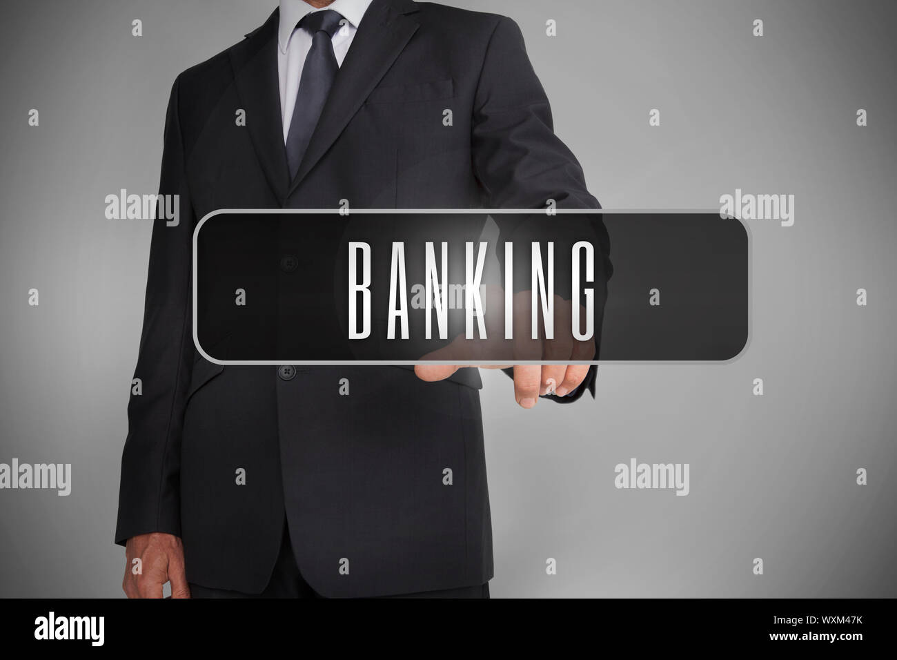 Businessman selecting label with banking written on it on grey ...