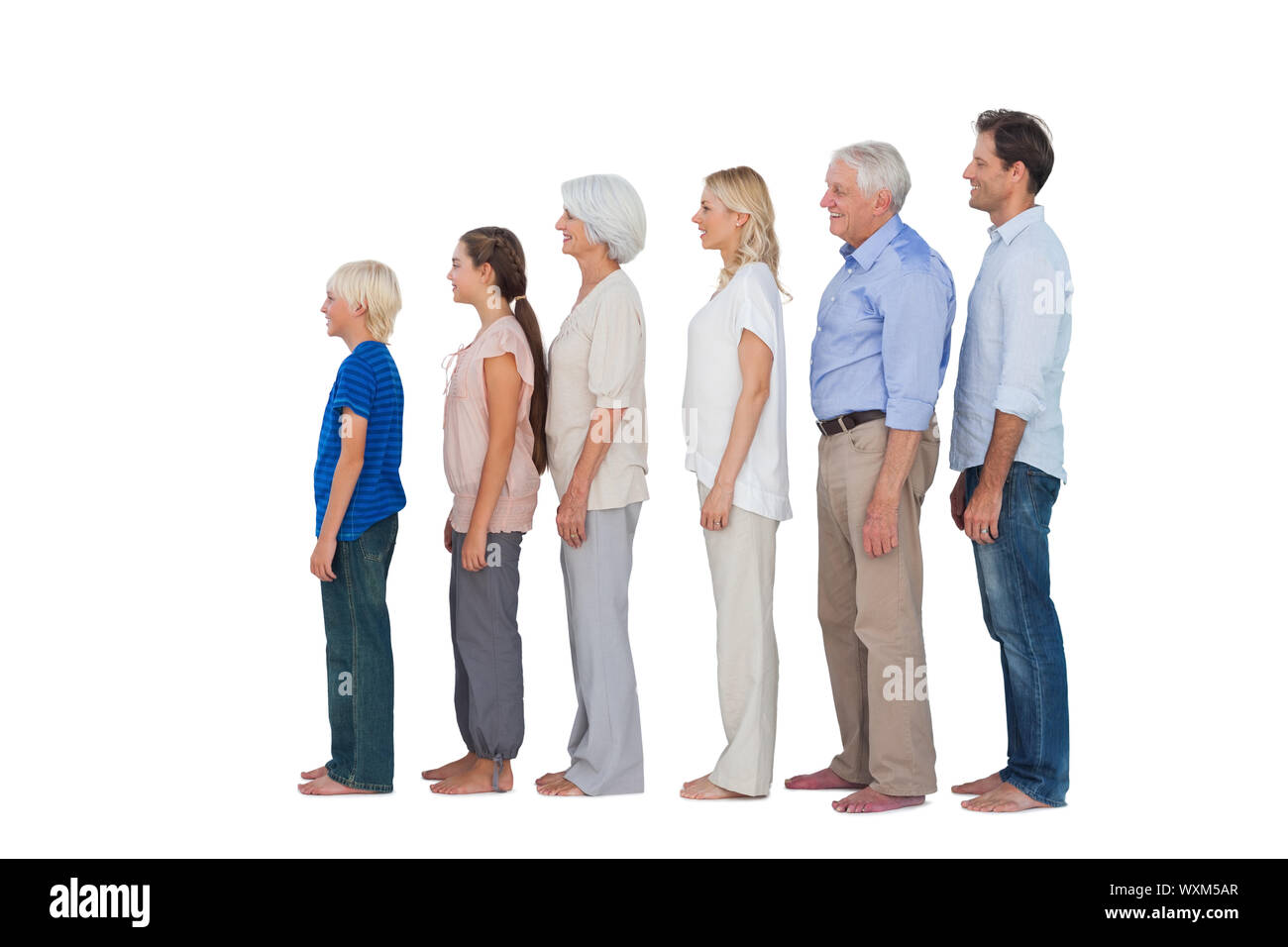 Multi-generation family posing together on white background Stock Photo ...