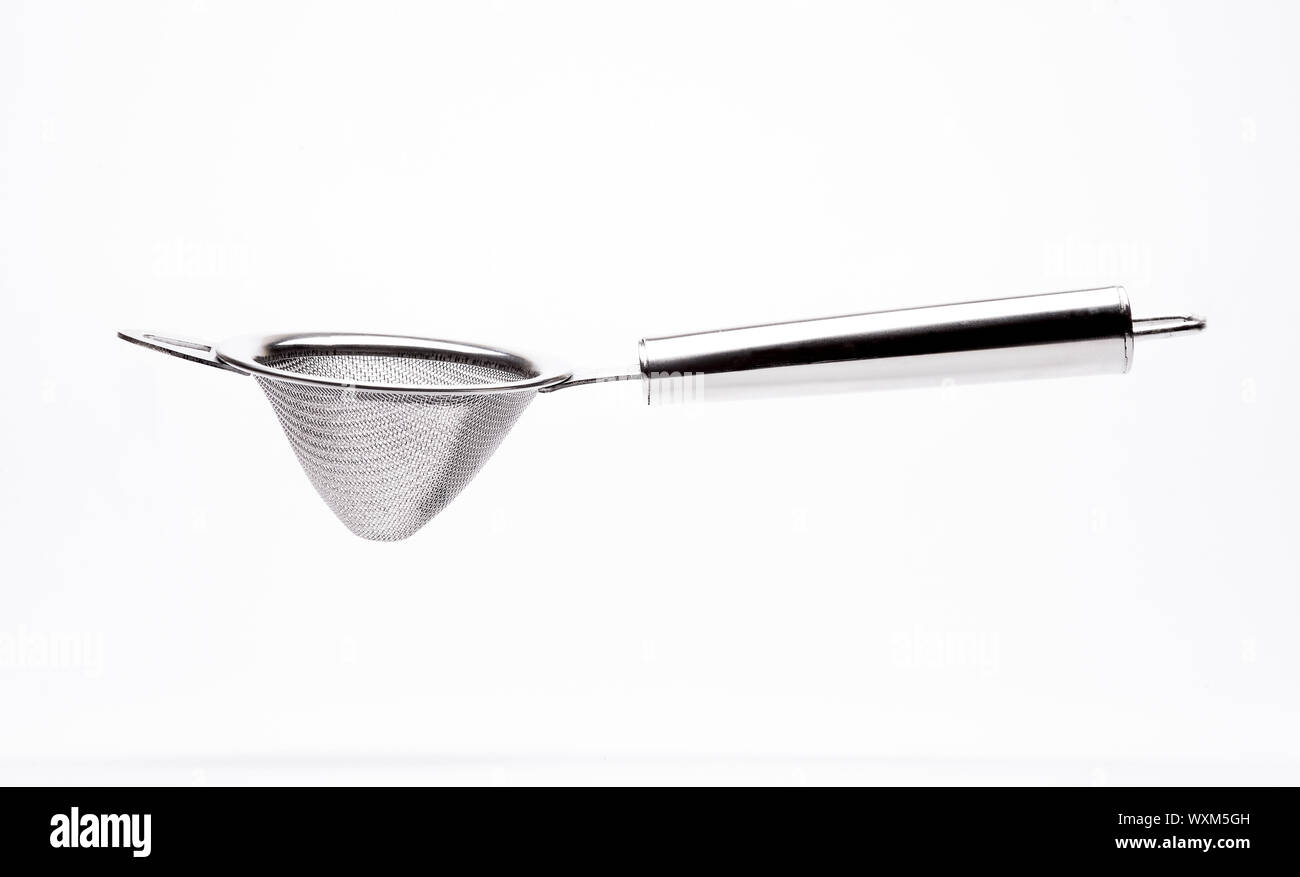 Stainless steel strainer in white background Stock Photo - Alamy