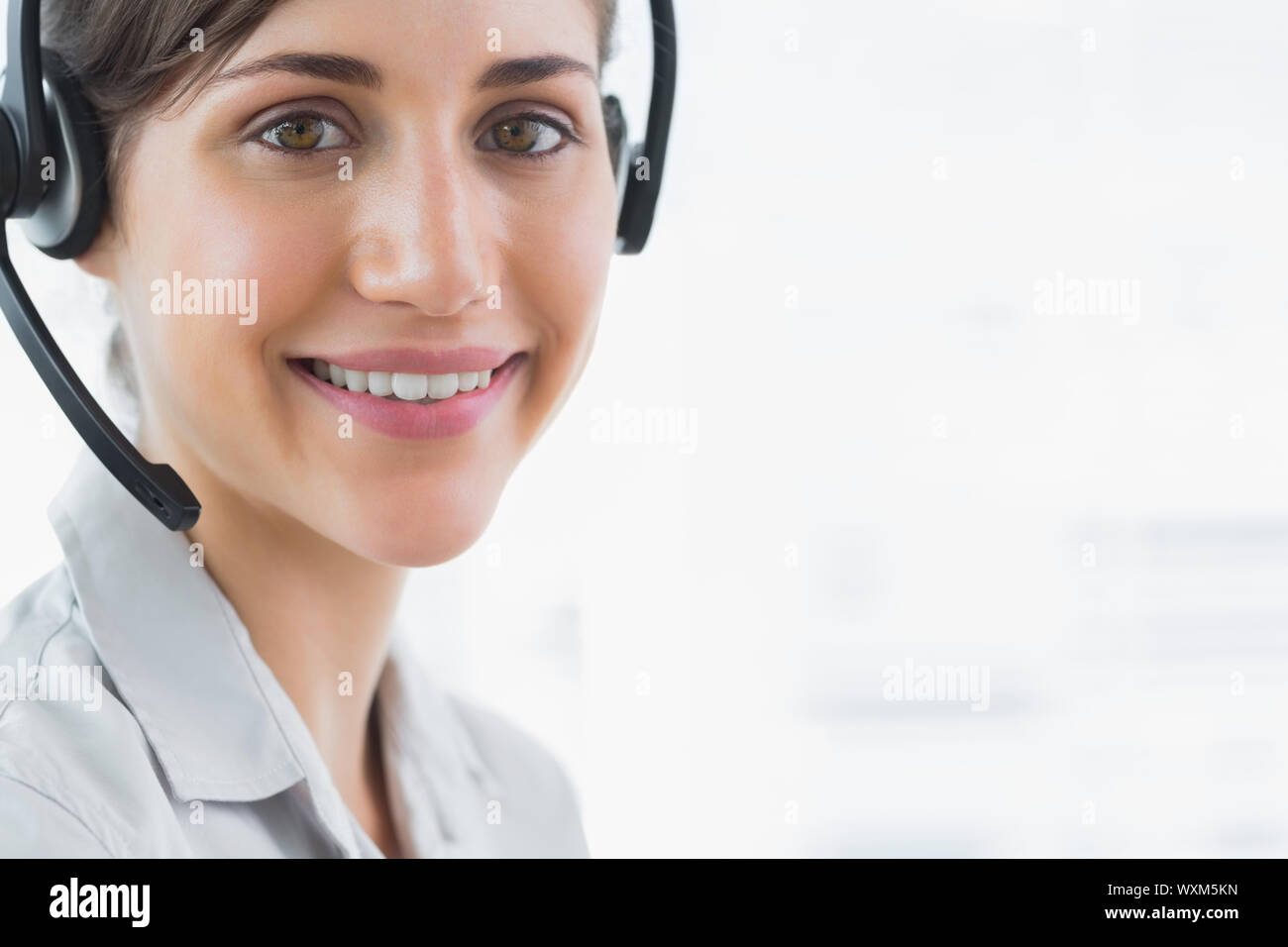 Call centre agent smiling camera hi-res stock photography and images ...