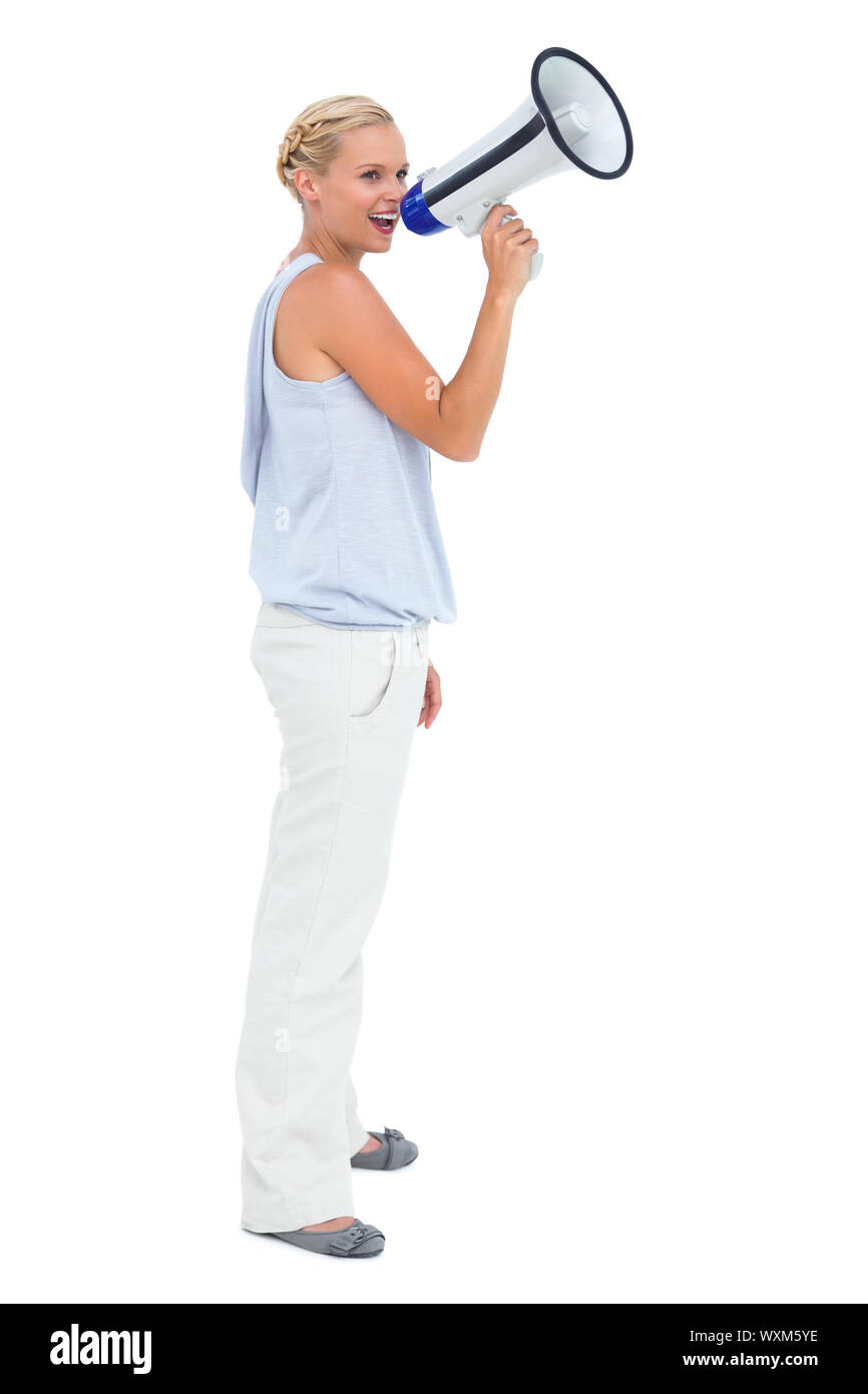 Woman shouting through megaphone on white background Stock Photo - Alamy