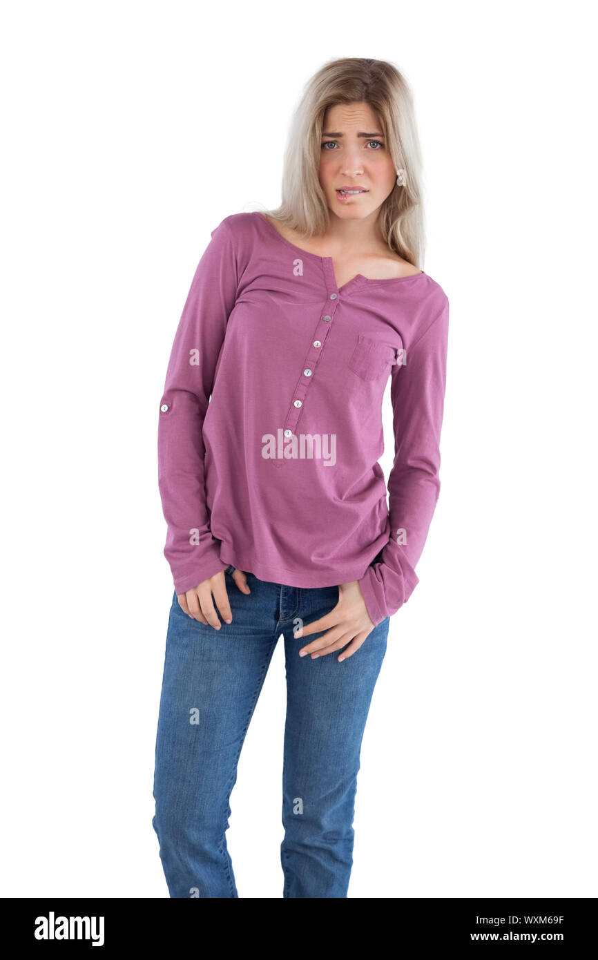 Nervous woman looking at the camera on a white background Stock Photo ...