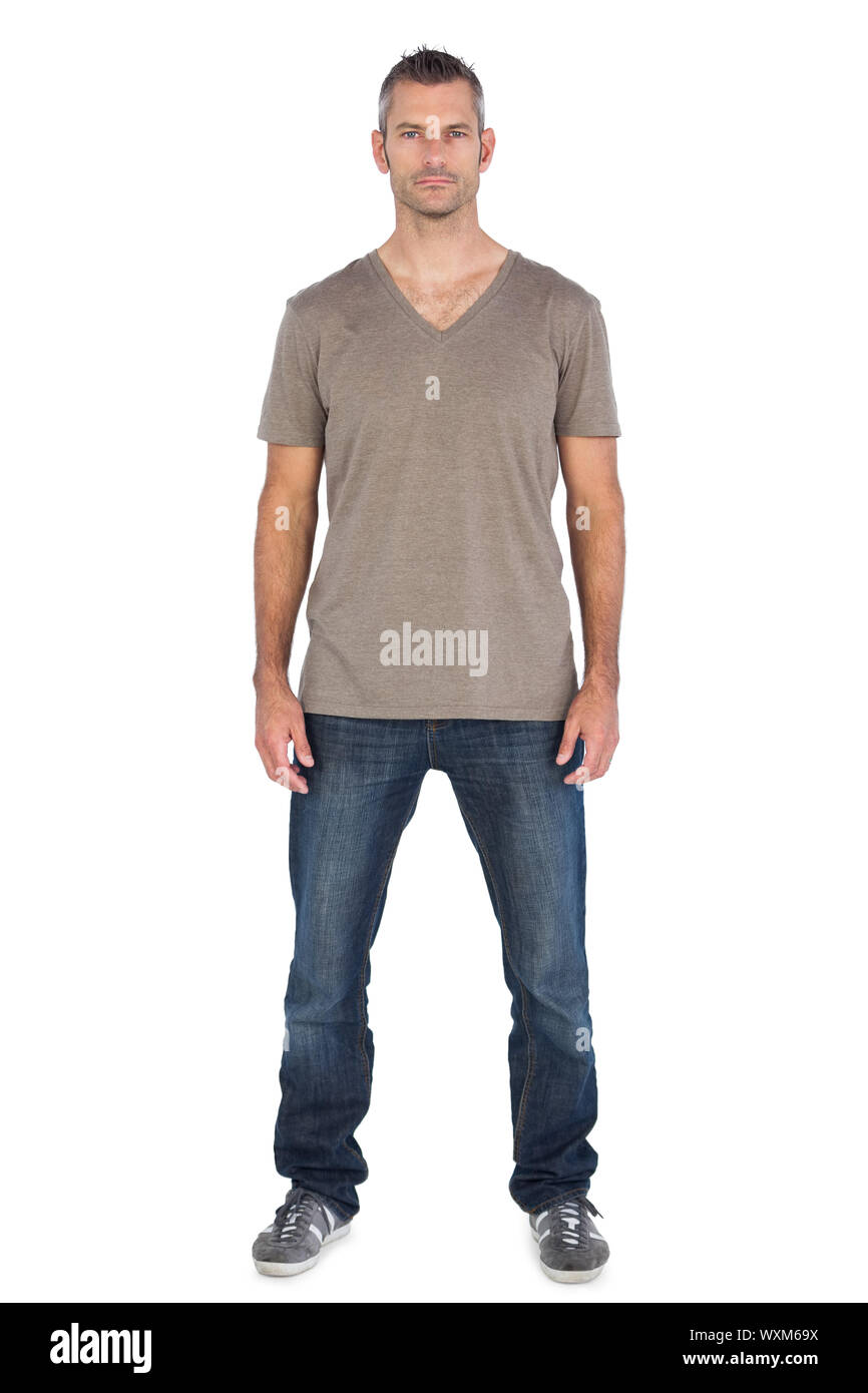 Serious standing man looking at the camera on a white background Stock ...