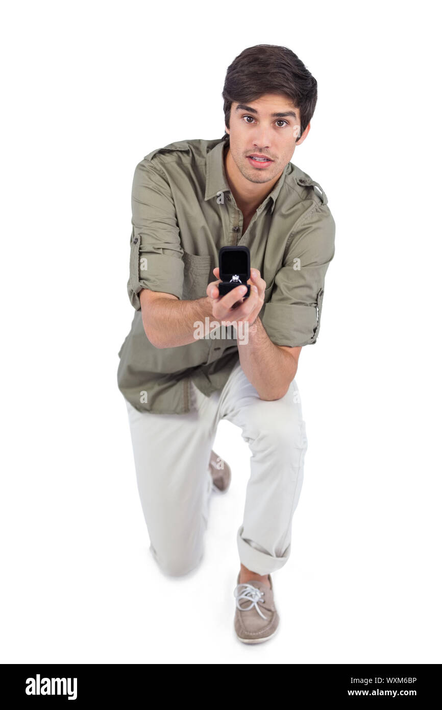 Surprised man making a marriage proposal on a white background Stock ...