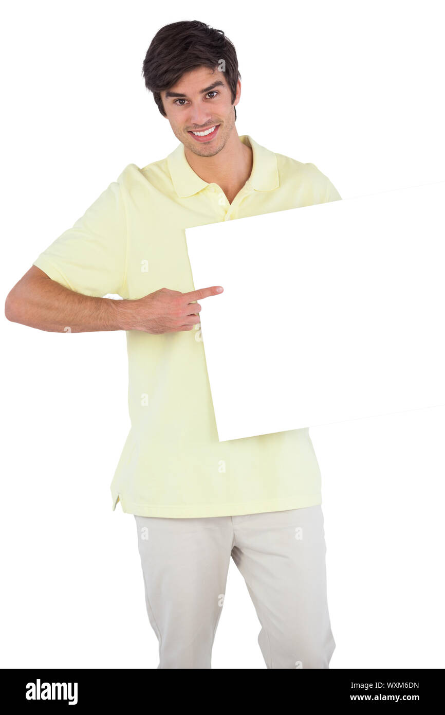 Happy man pointing something on empty sign on a white background Stock ...