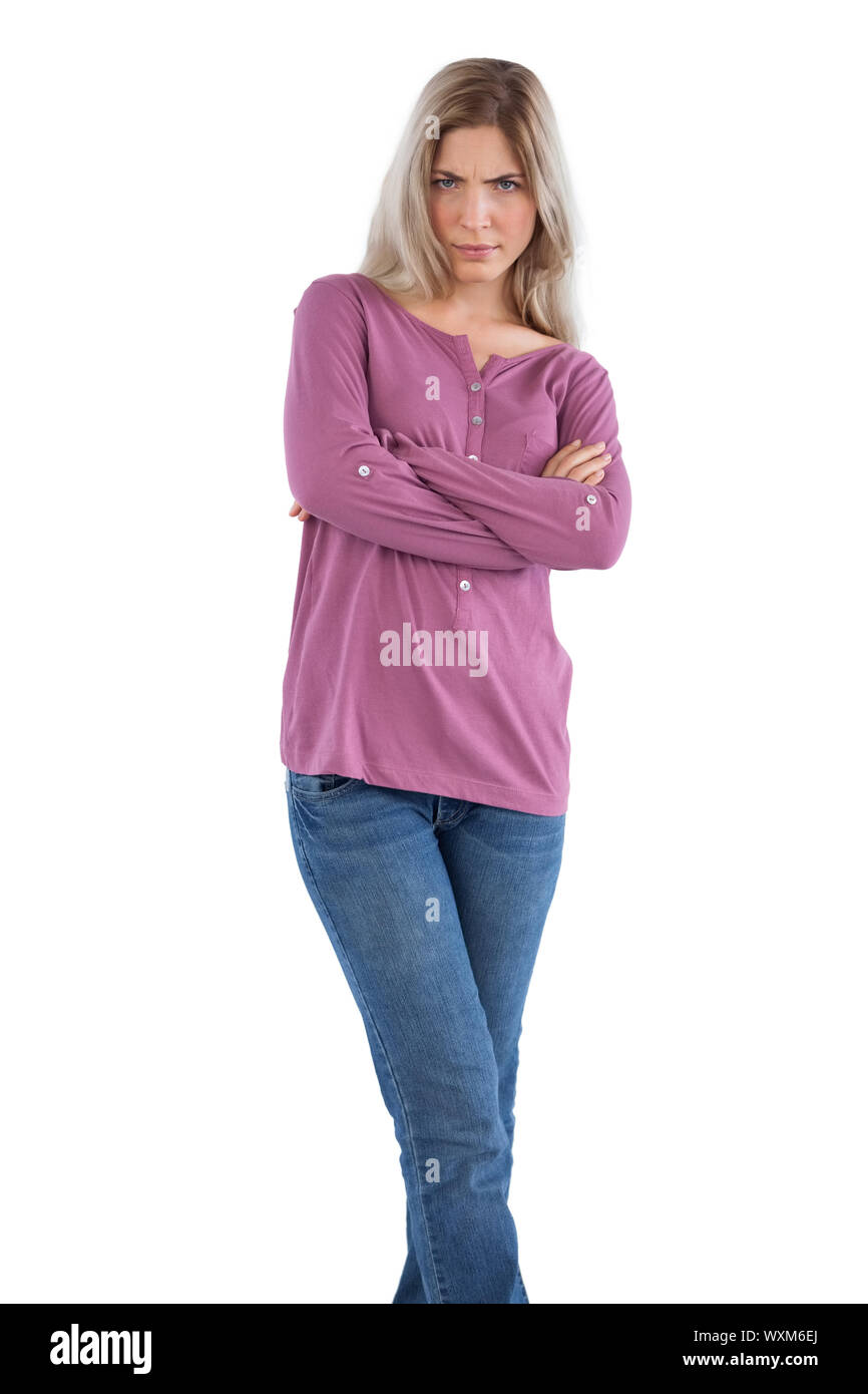 Angry woman with arms crossed on a white background Stock Photo - Alamy